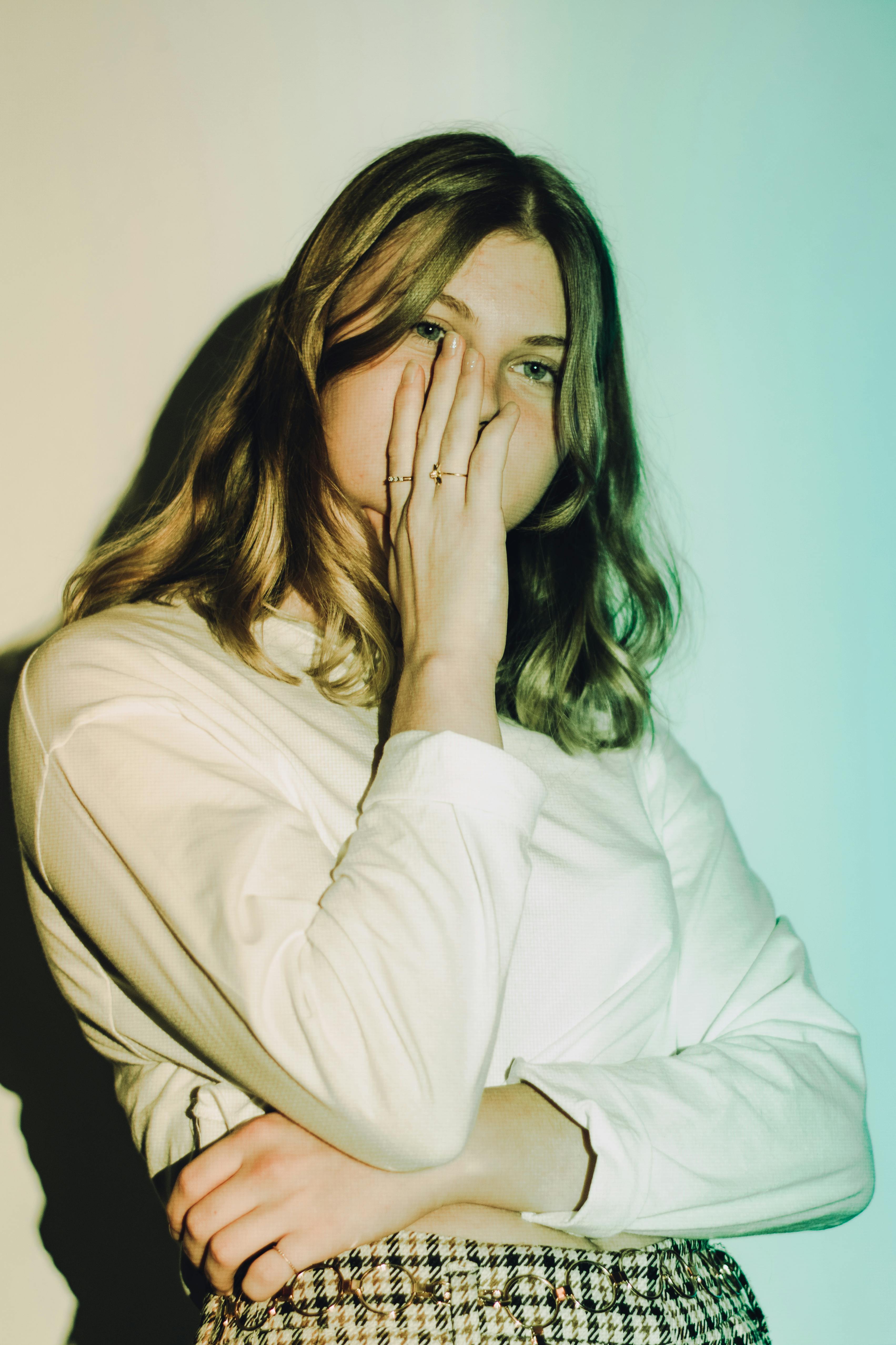 Portrait of Woman with Hand over Nose · Free Stock Photo