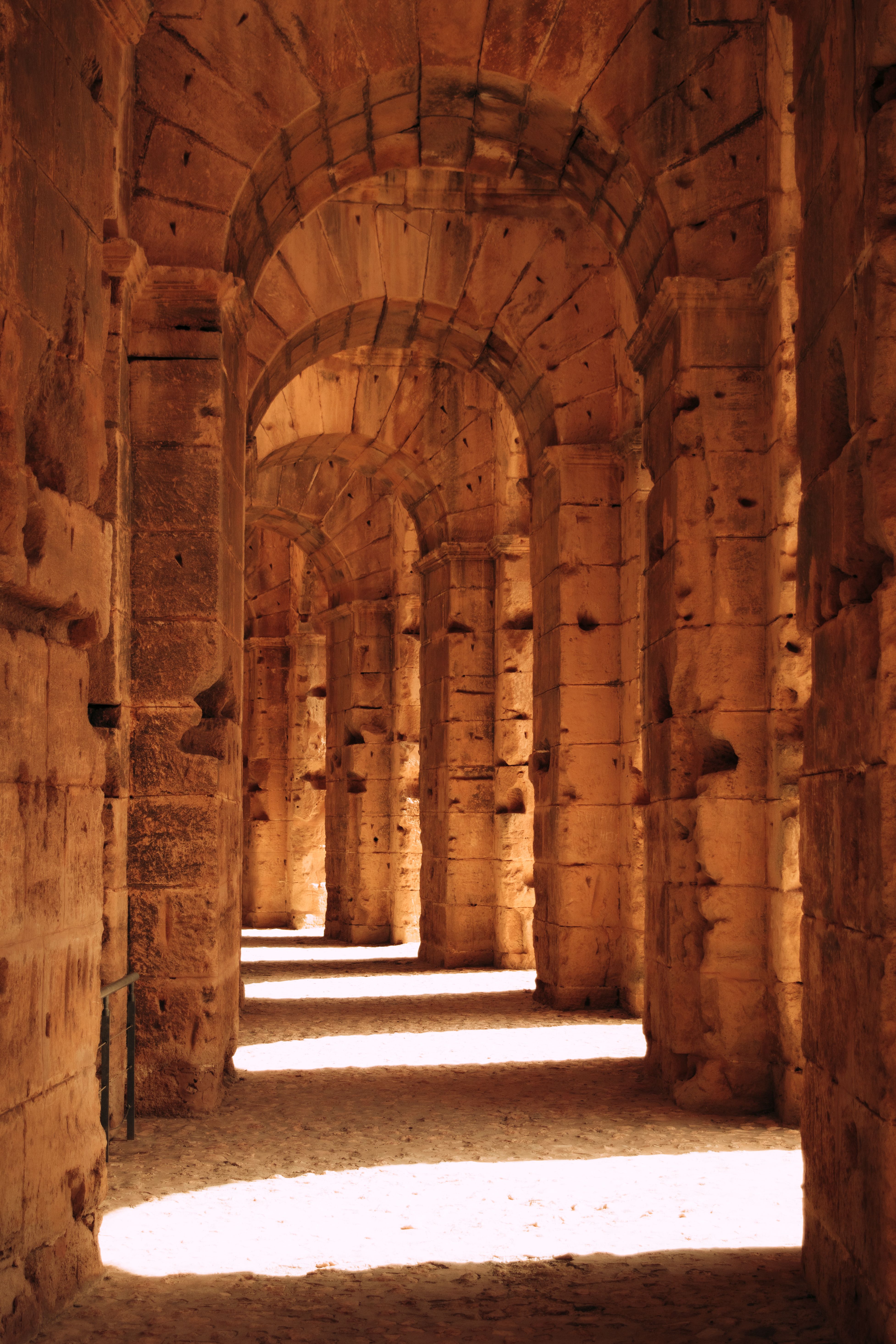 Arched passage in ancient palace with shabby walls · Free Stock Photo