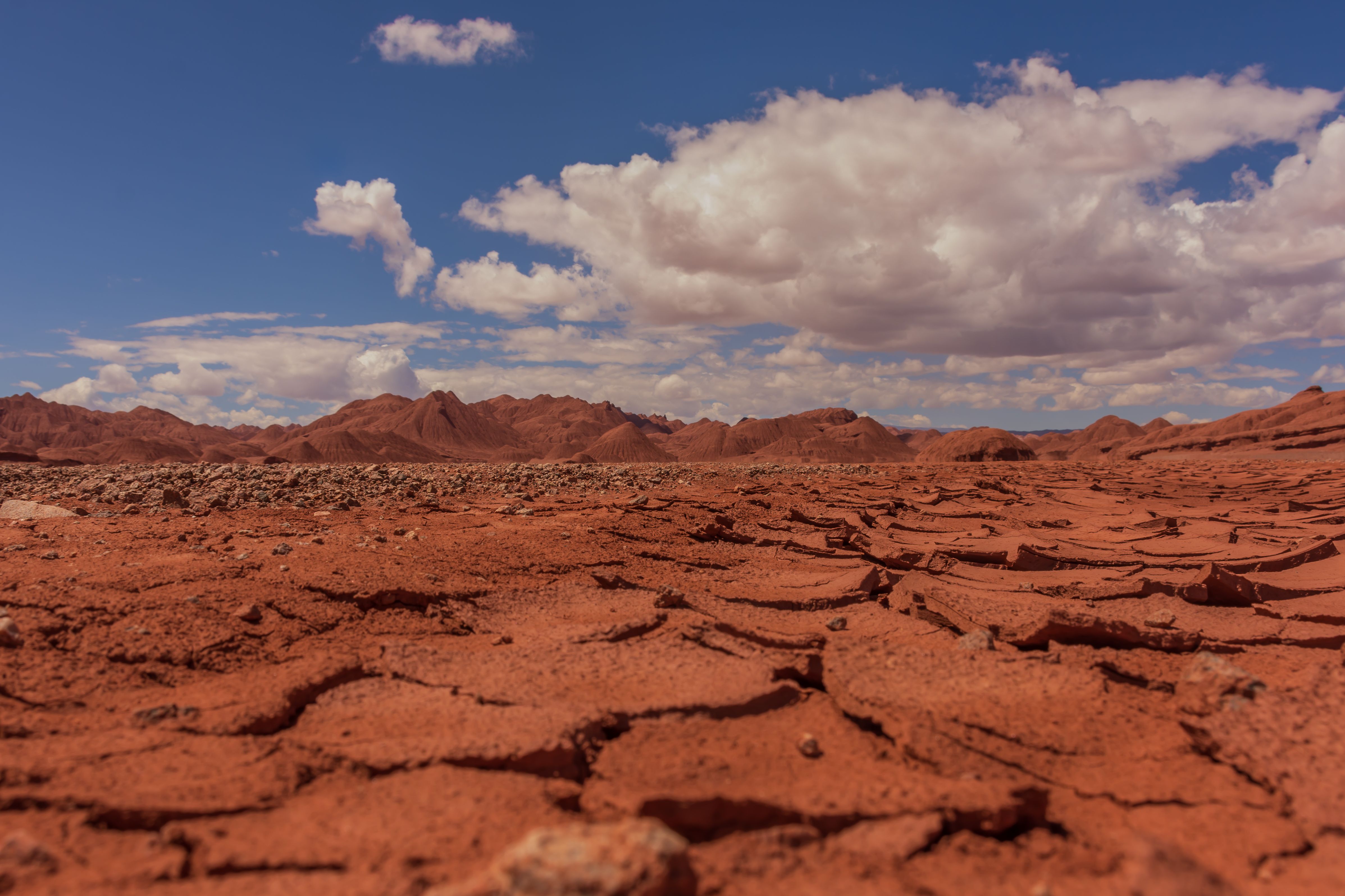 View of Arid Desert Landscape with Distant Hills · Free Stock Photo