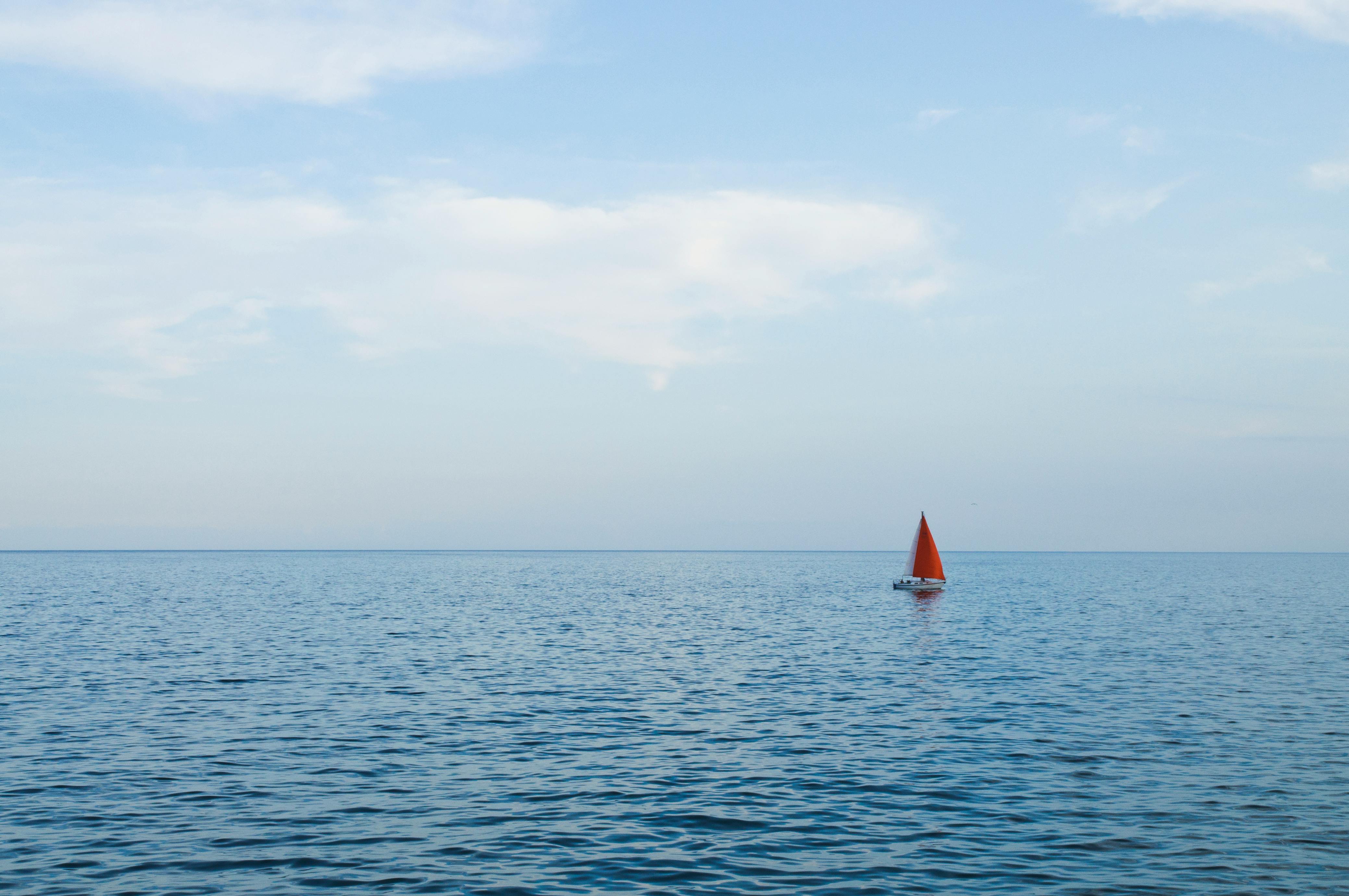 Sailboat Sailing on Sea Against Sky · Free Stock Photo