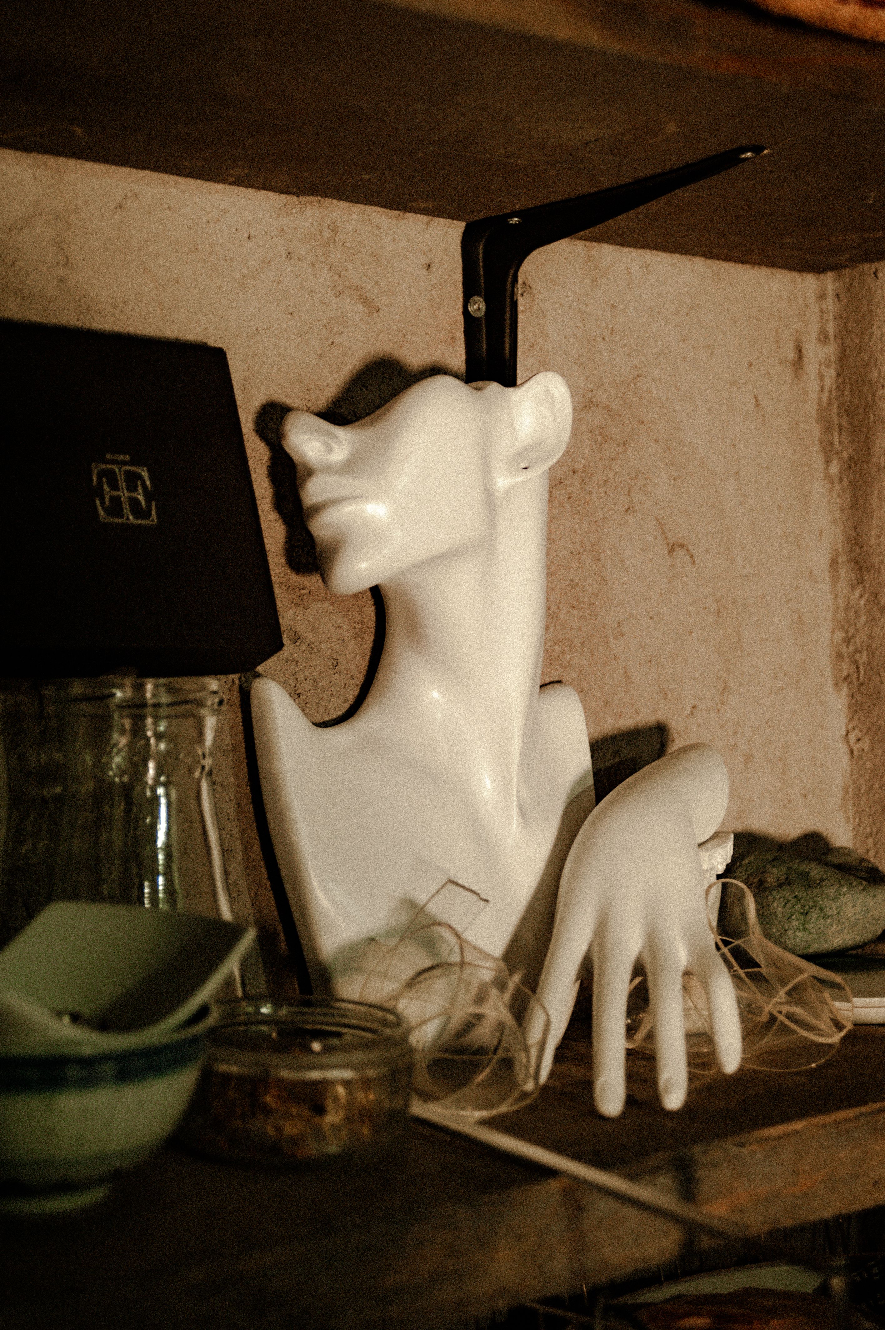 Mannequin Bust and Hand on Shelf · Free Stock Photo