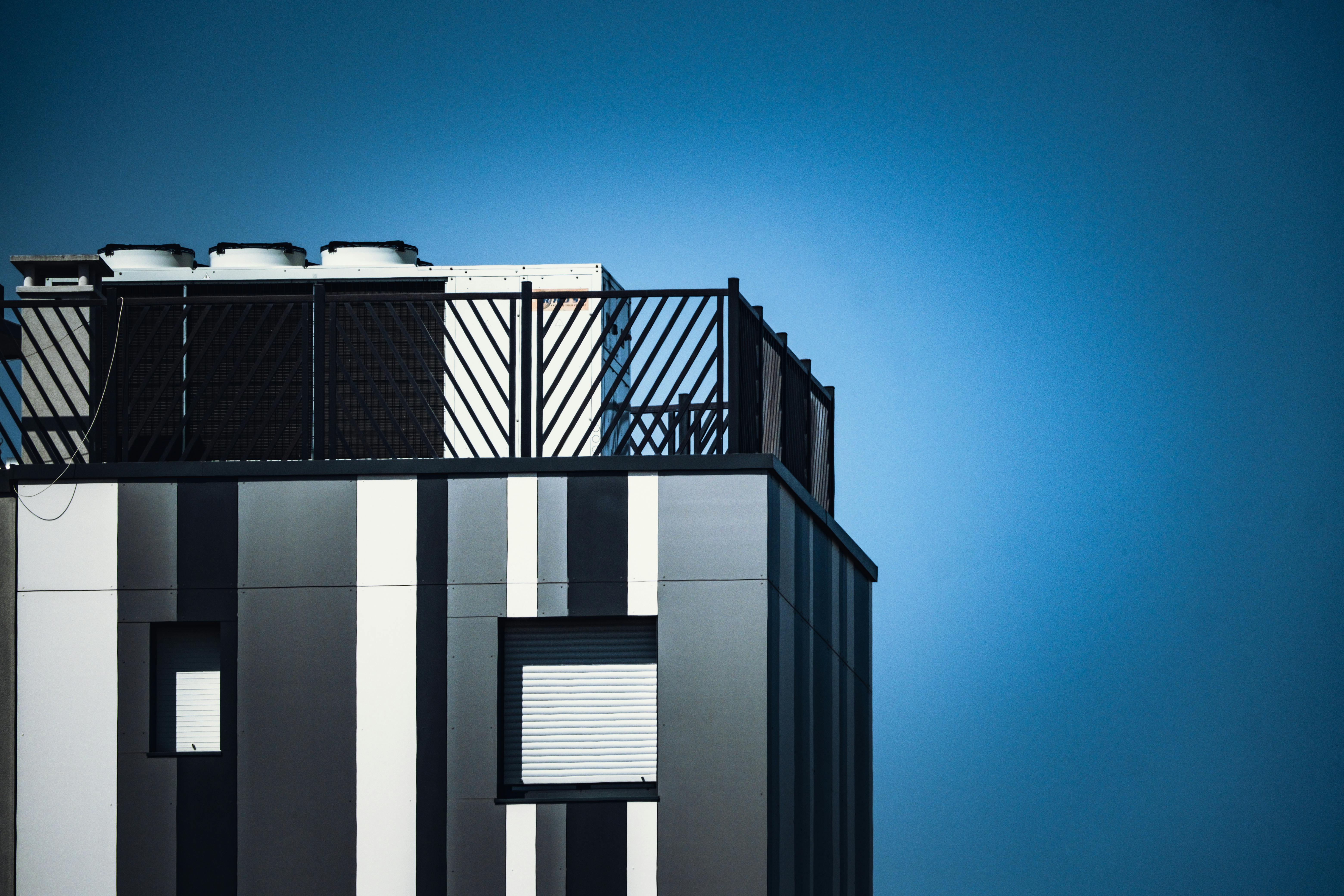 Striped Building Against the Blue Sky · Free Stock Photo