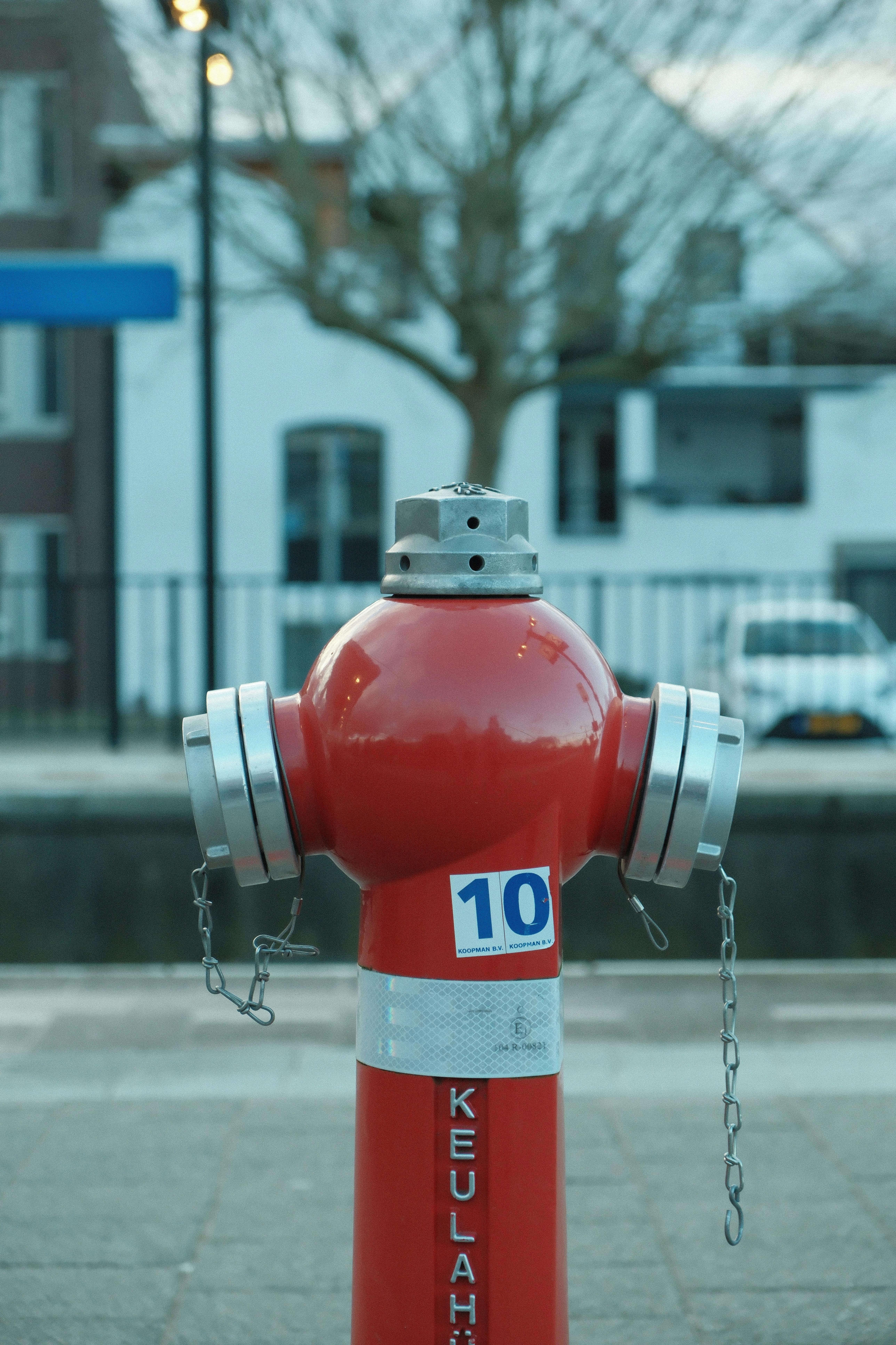 A red fire hydrant with a number on it · Free Stock Photo