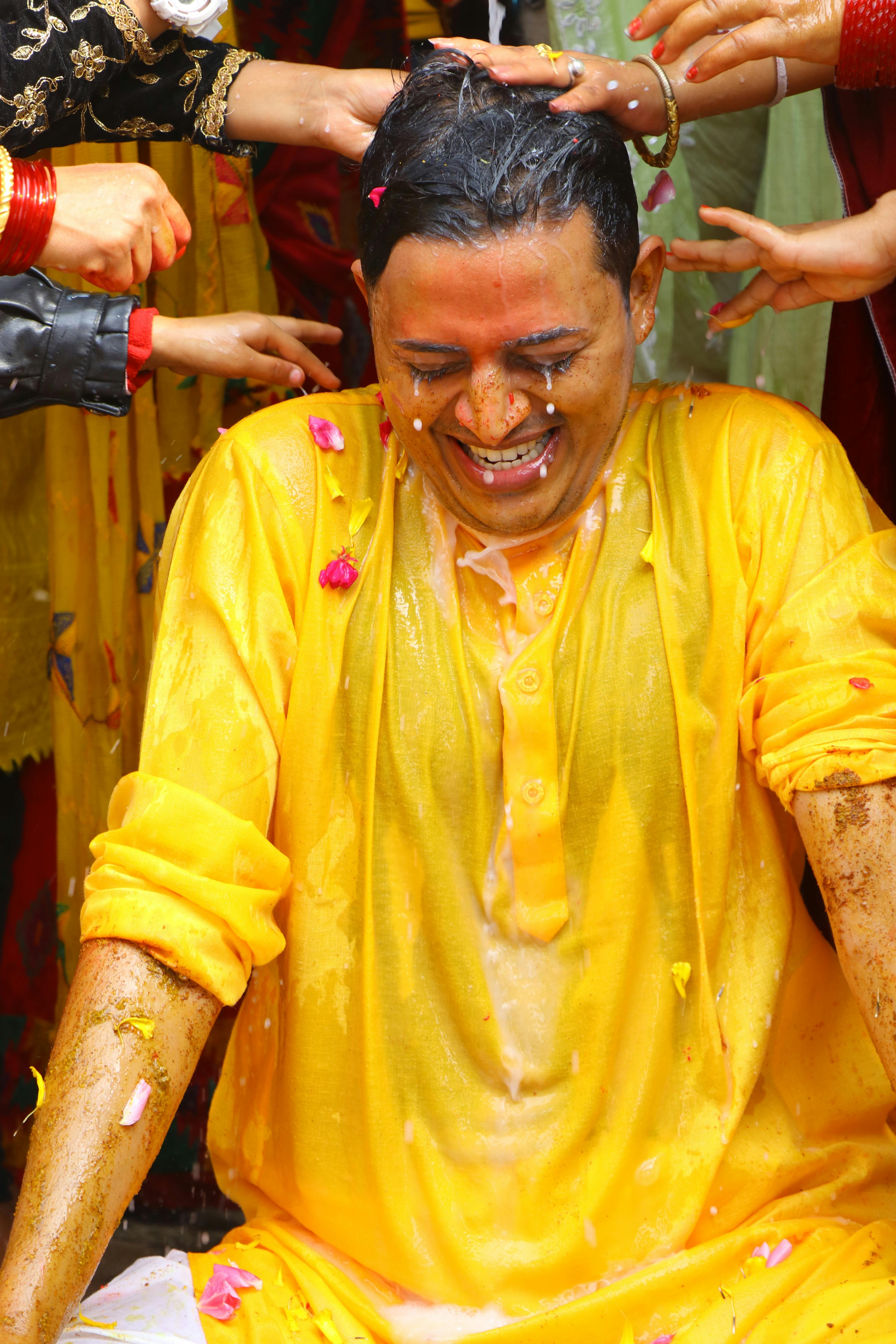 Smiling Man in Yellow Clothes Sitting in Traditional Ceremony · Free ...