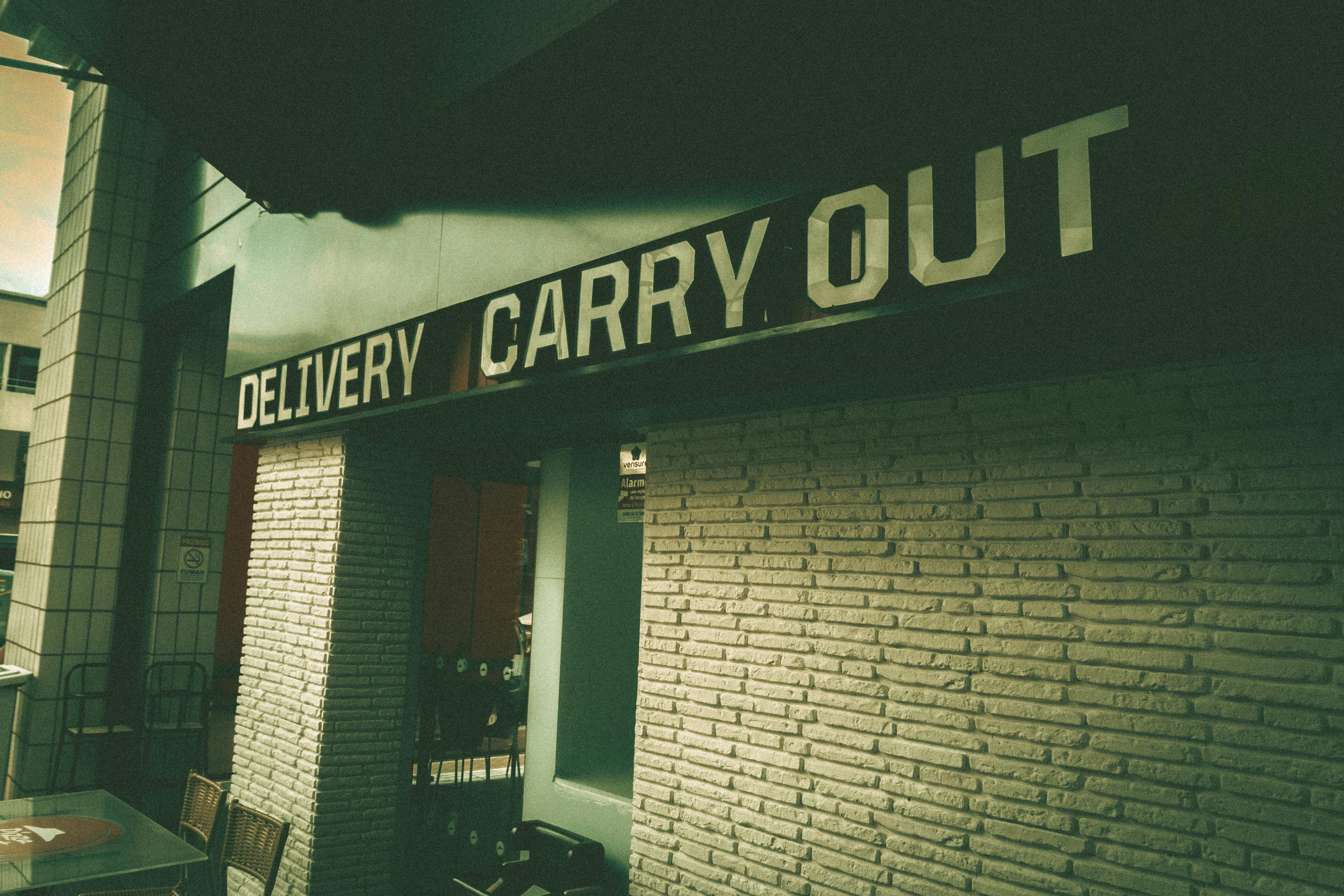 Delivery and Carry Out Text on Wall · Free Stock Photo