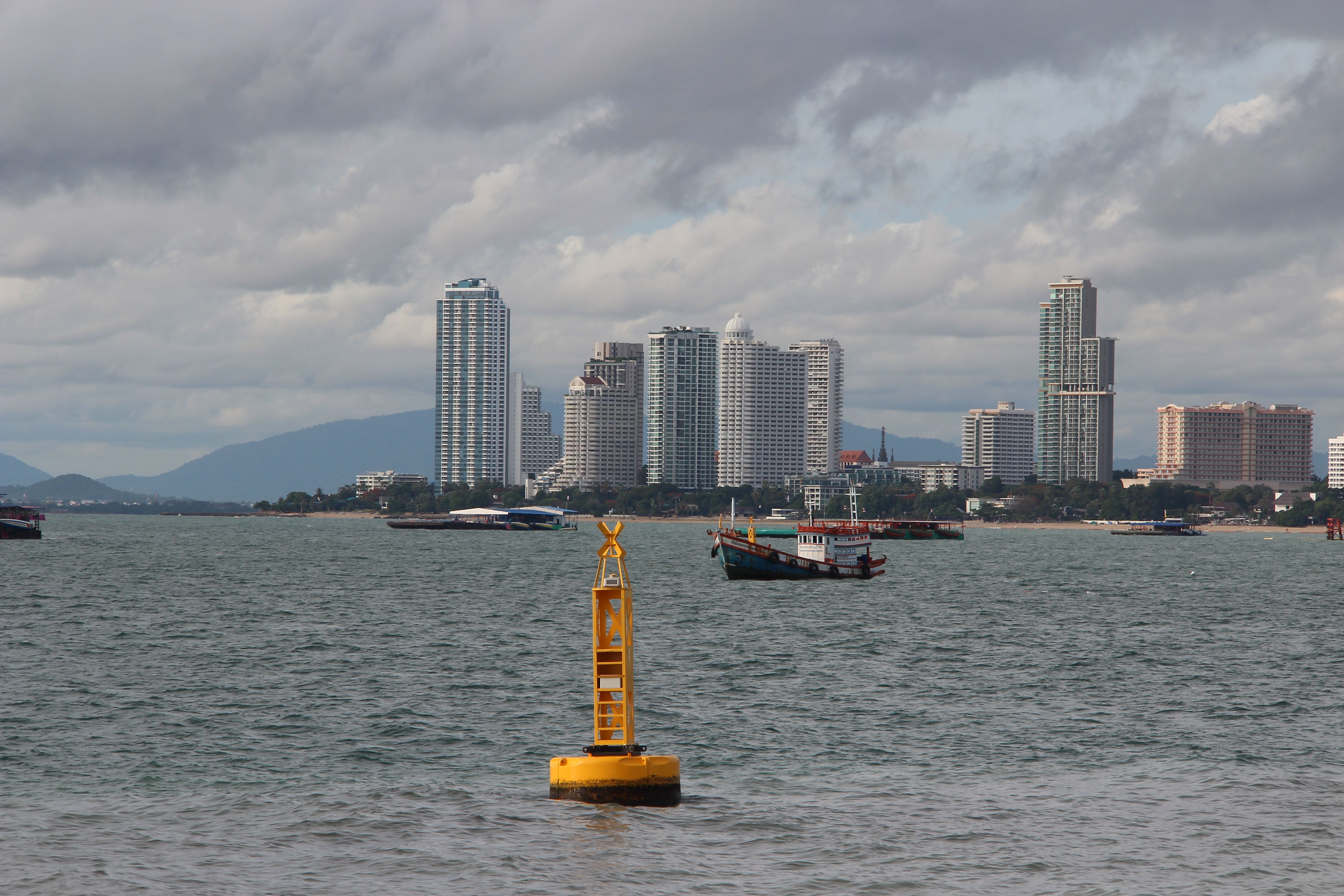 View of Boats Sailing near the Shore with Skyscrapers in the Background ...