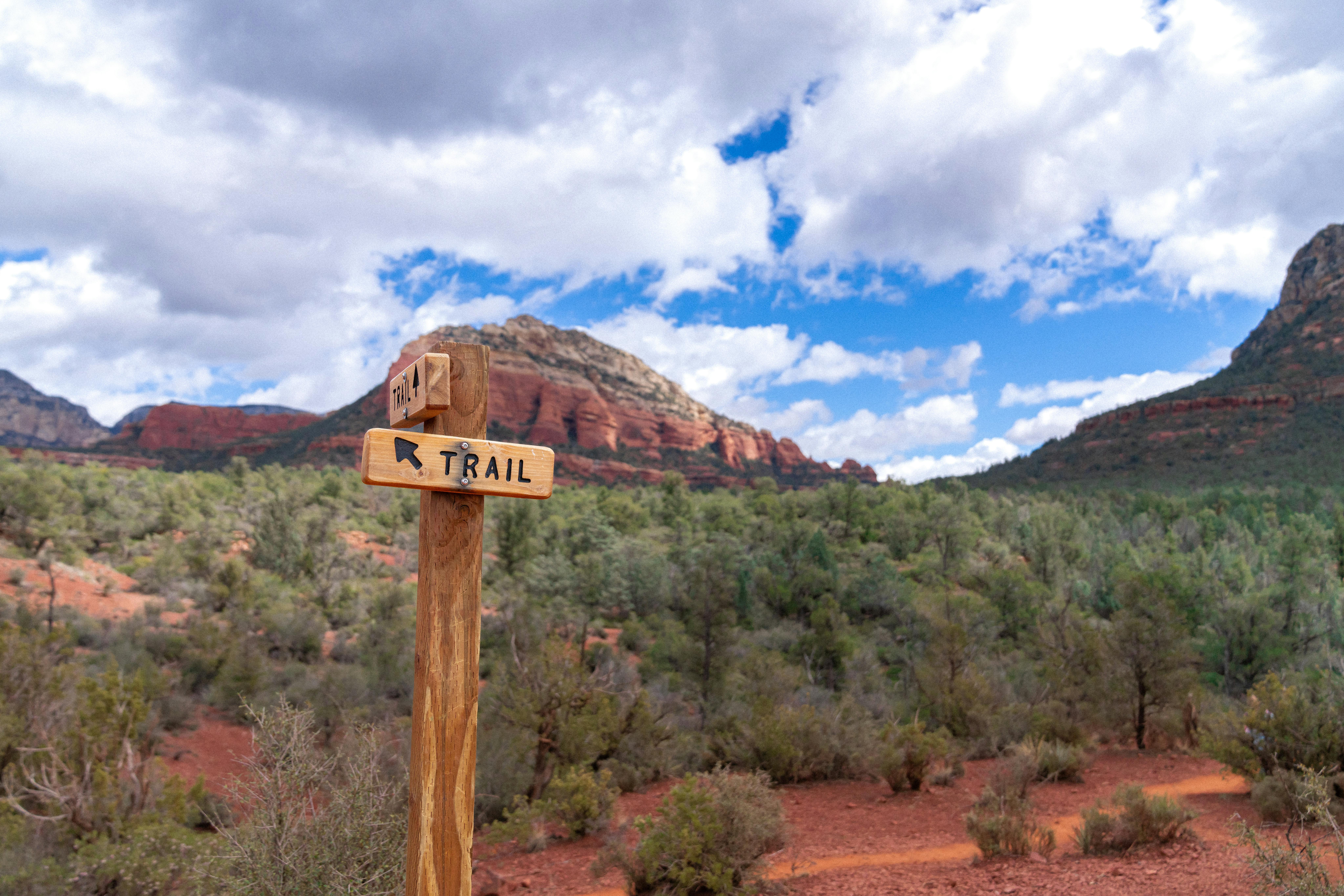 A Wooden Sign Showing the Directions to the Trails in Sedona, Arizona ...