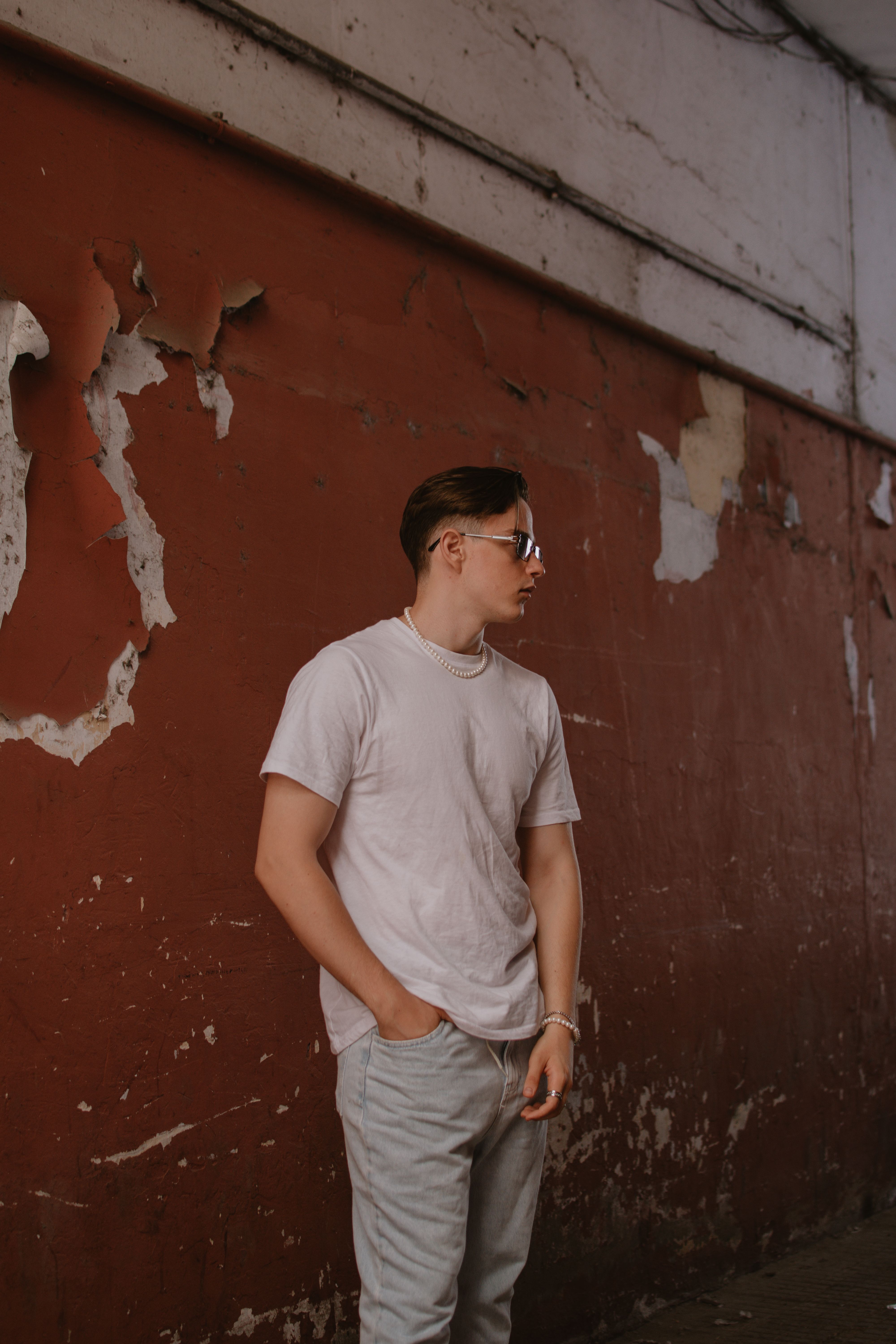 A Man Standing by a Wall · Free Stock Photo