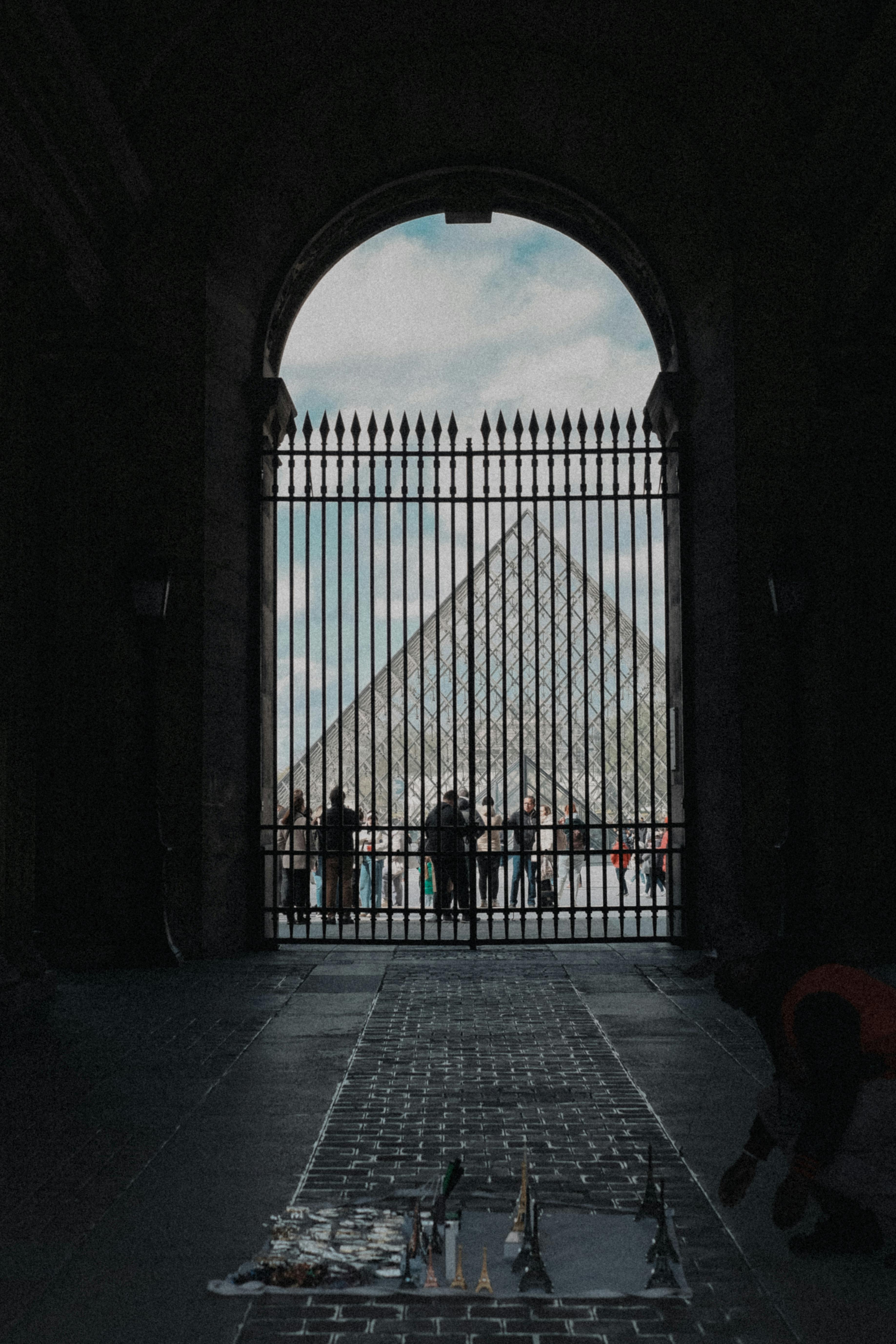 Louvre Pyramid behind Gate · Free Stock Photo