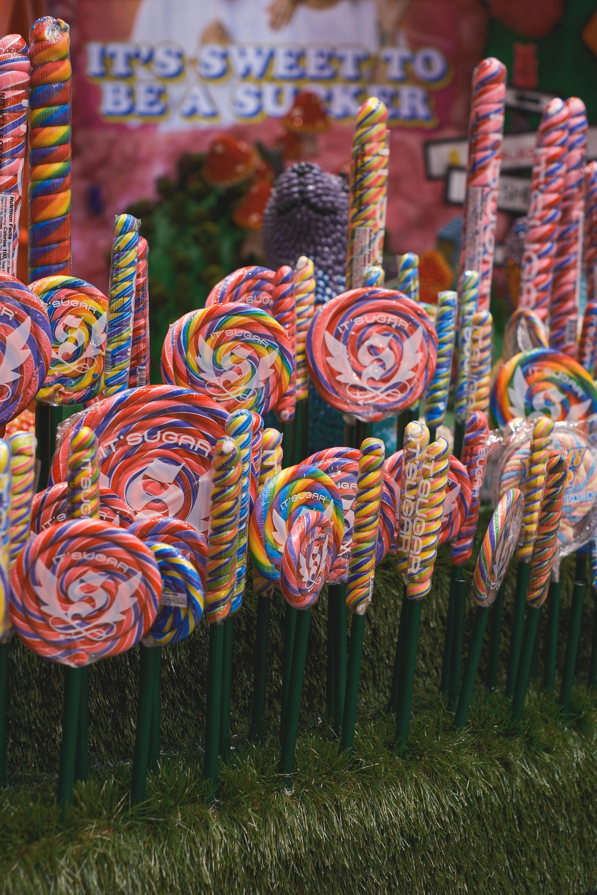 A display of lollipops and candy on sticks · Free Stock Photo