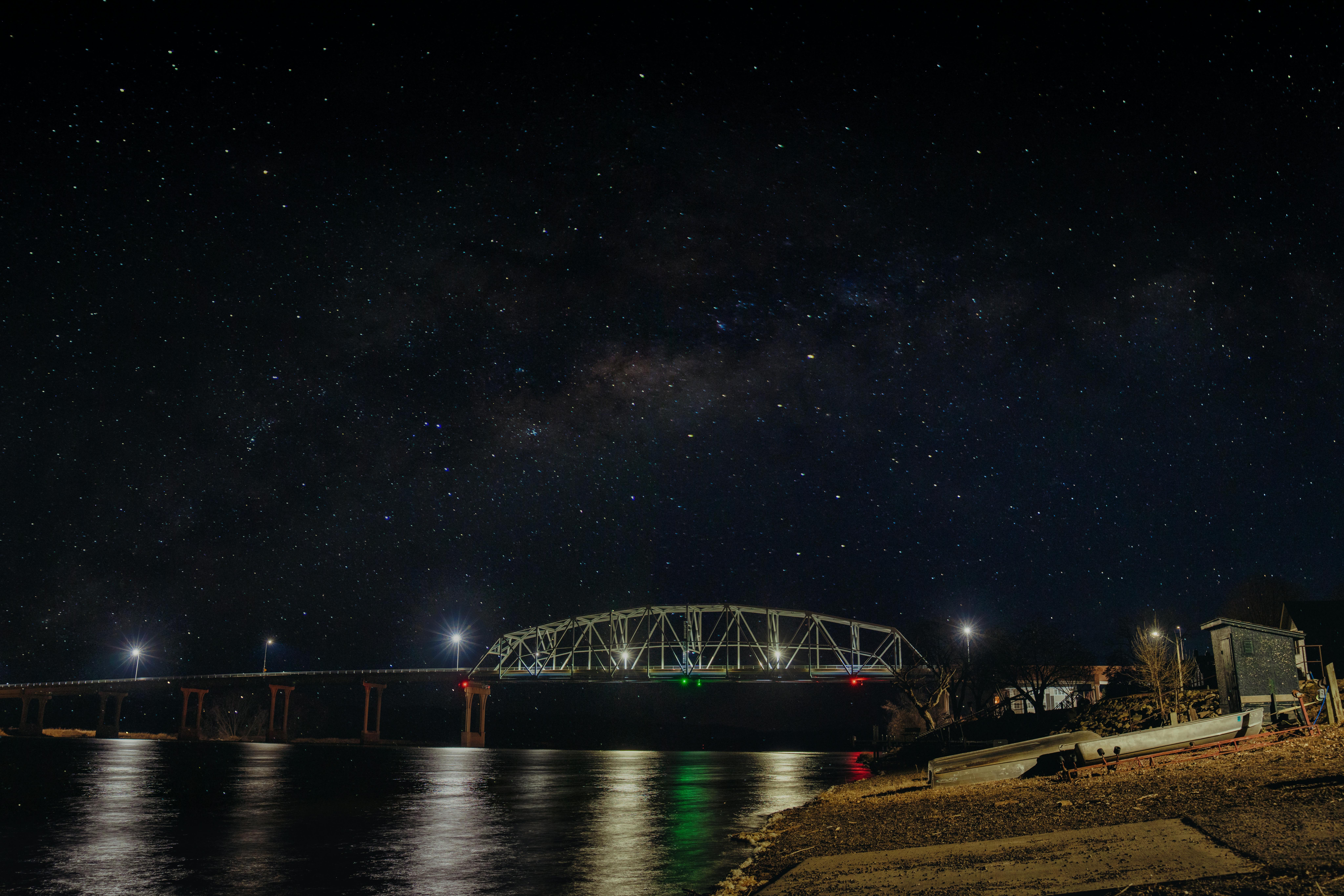 Stars on Night Sky over Bridge on River · Free Stock Photo