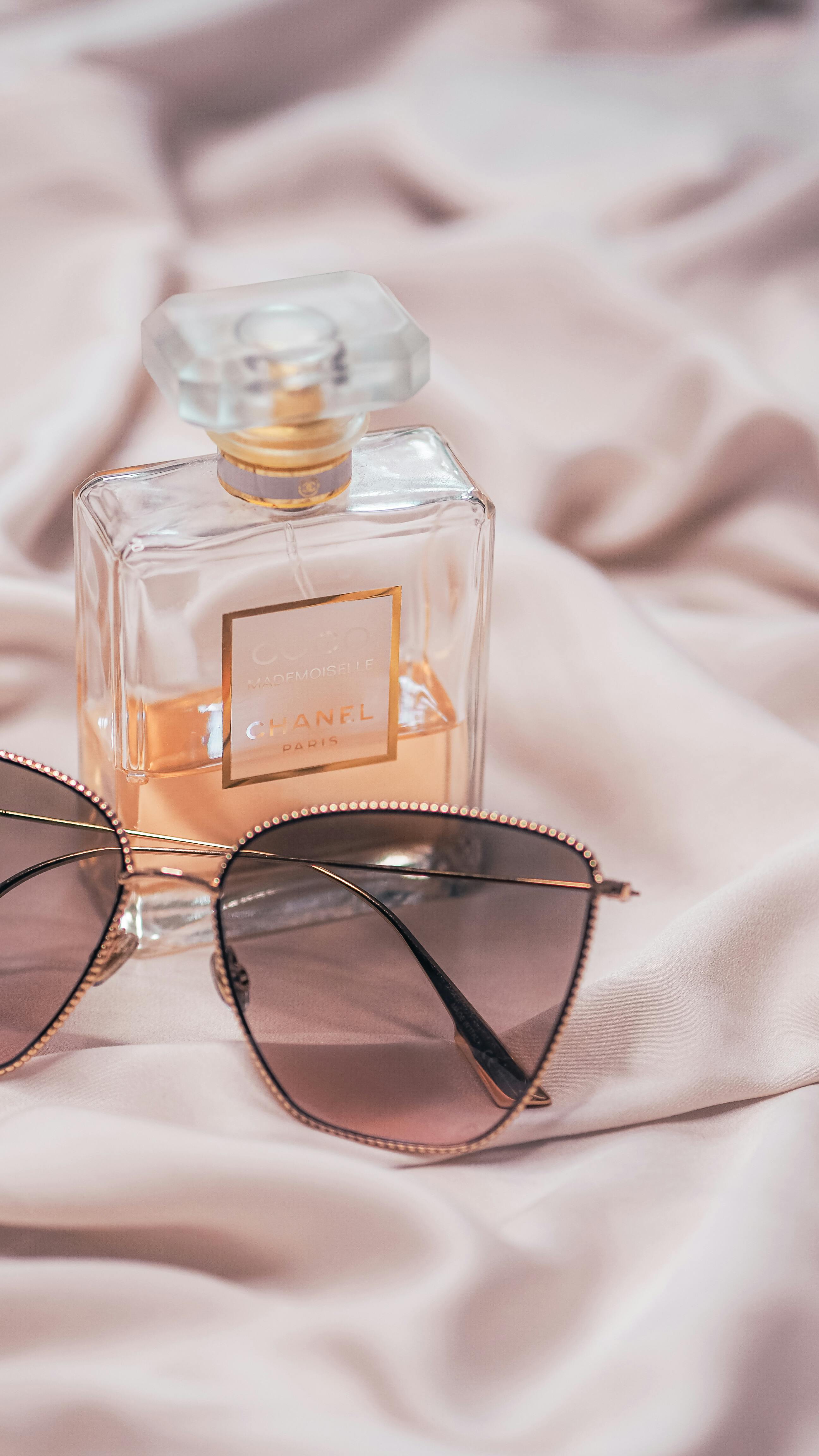 Luxurious Perfume Bottle on a Golden Silk Textile · Free Stock Photo