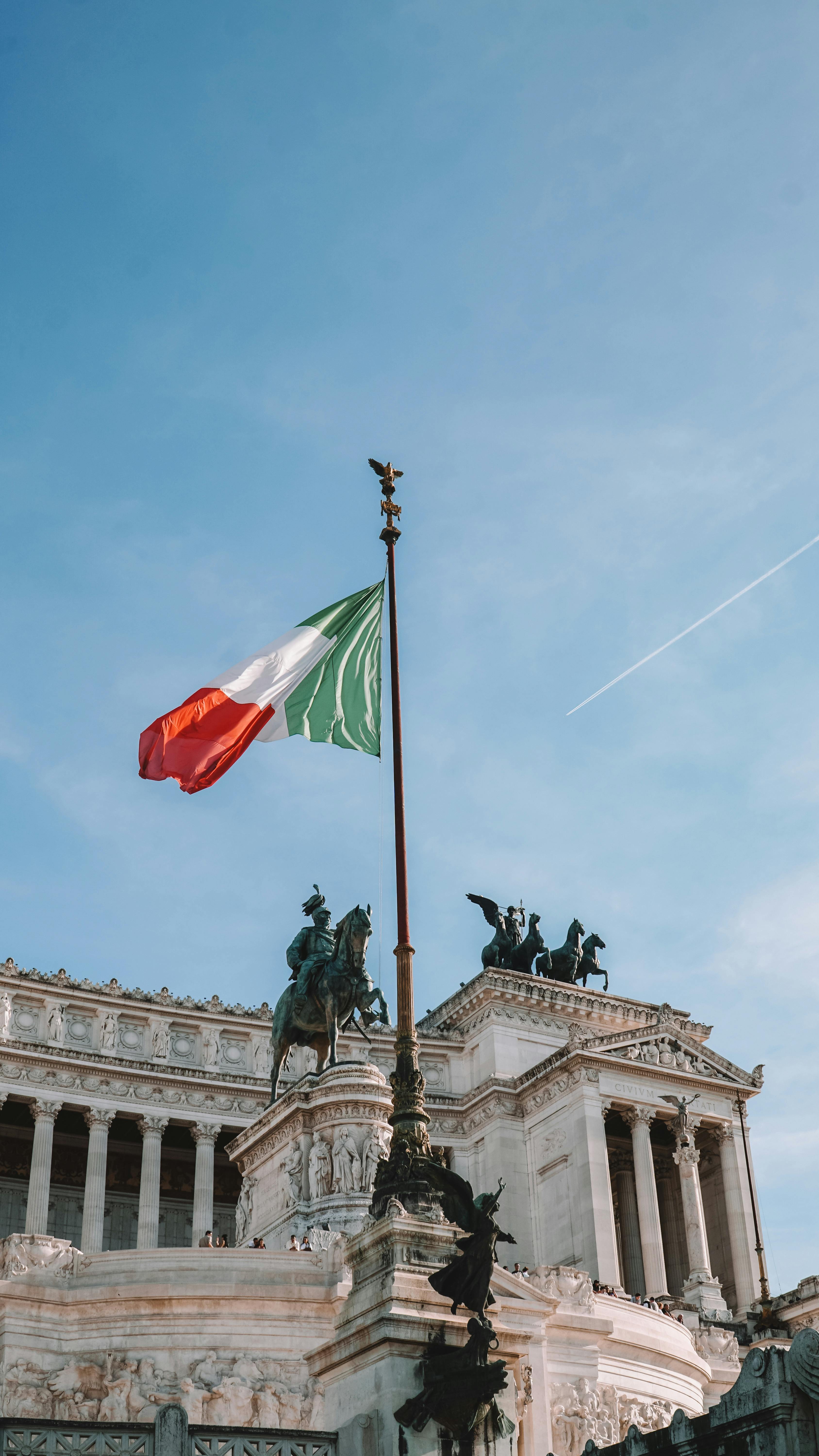 Italian Flag Flying Above Piazza Venezia in Rome · Free Stock Photo