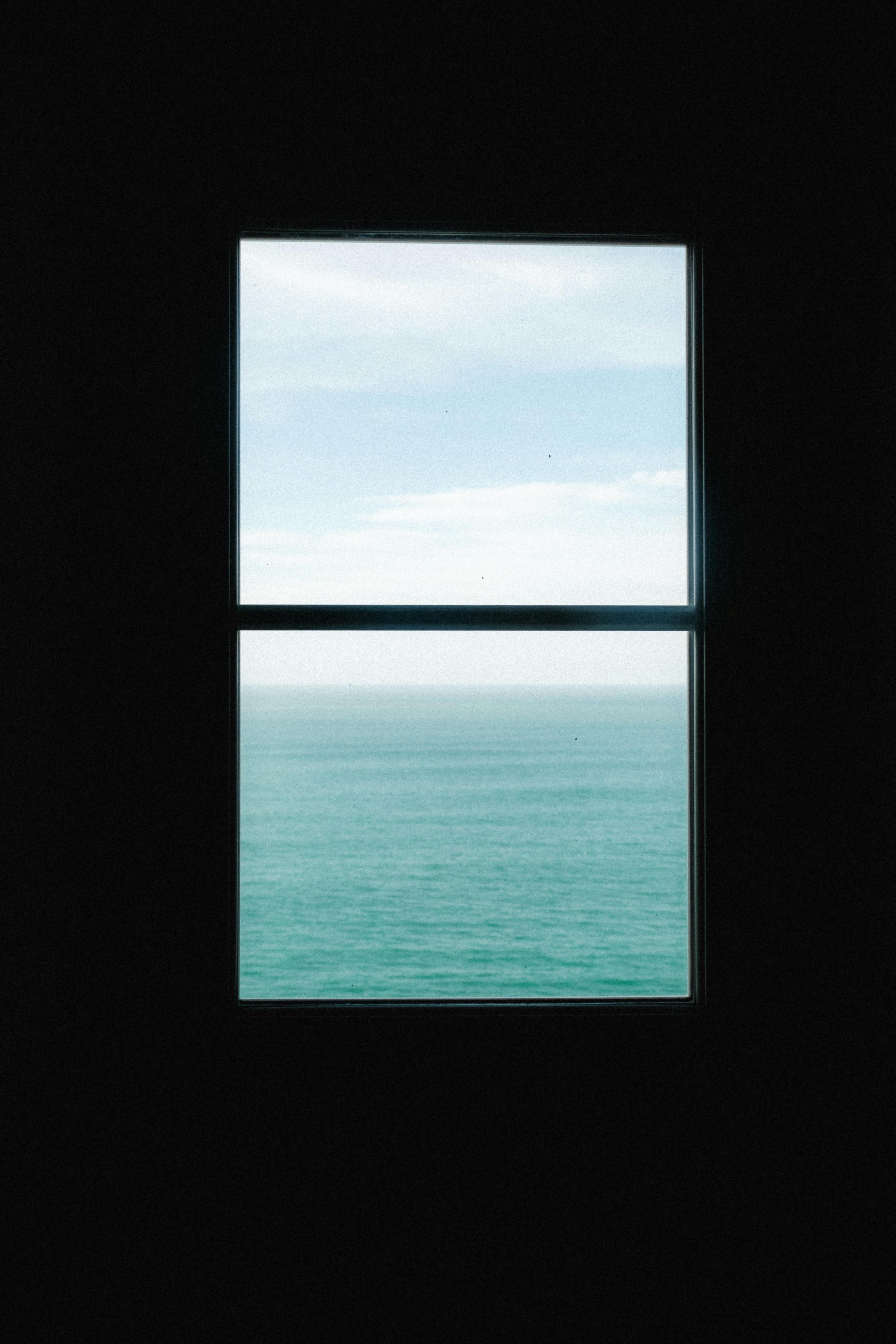 Seascape Peaking Through a Window · Free Stock Photo