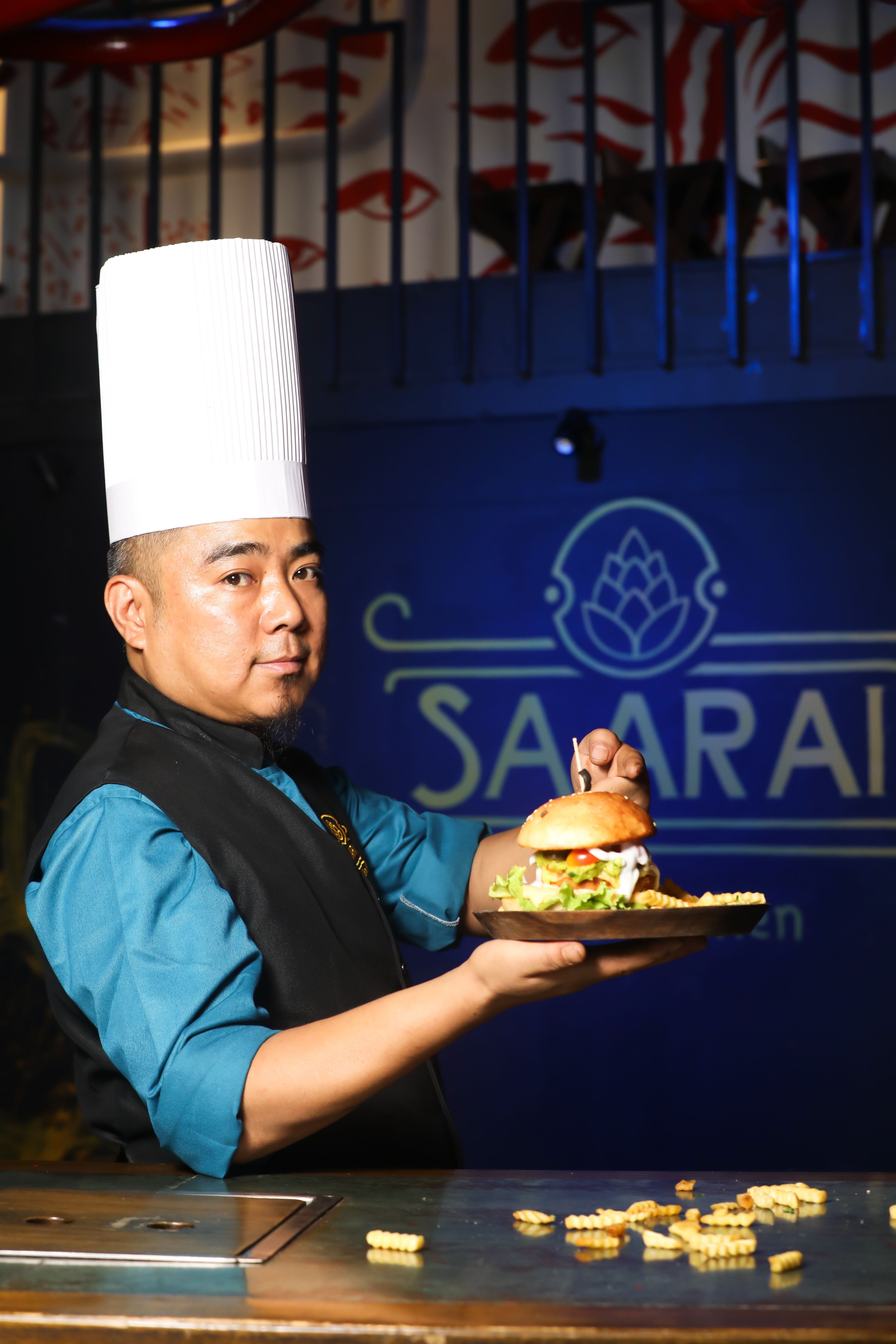 Chef Presenting Burger · Free Stock Photo