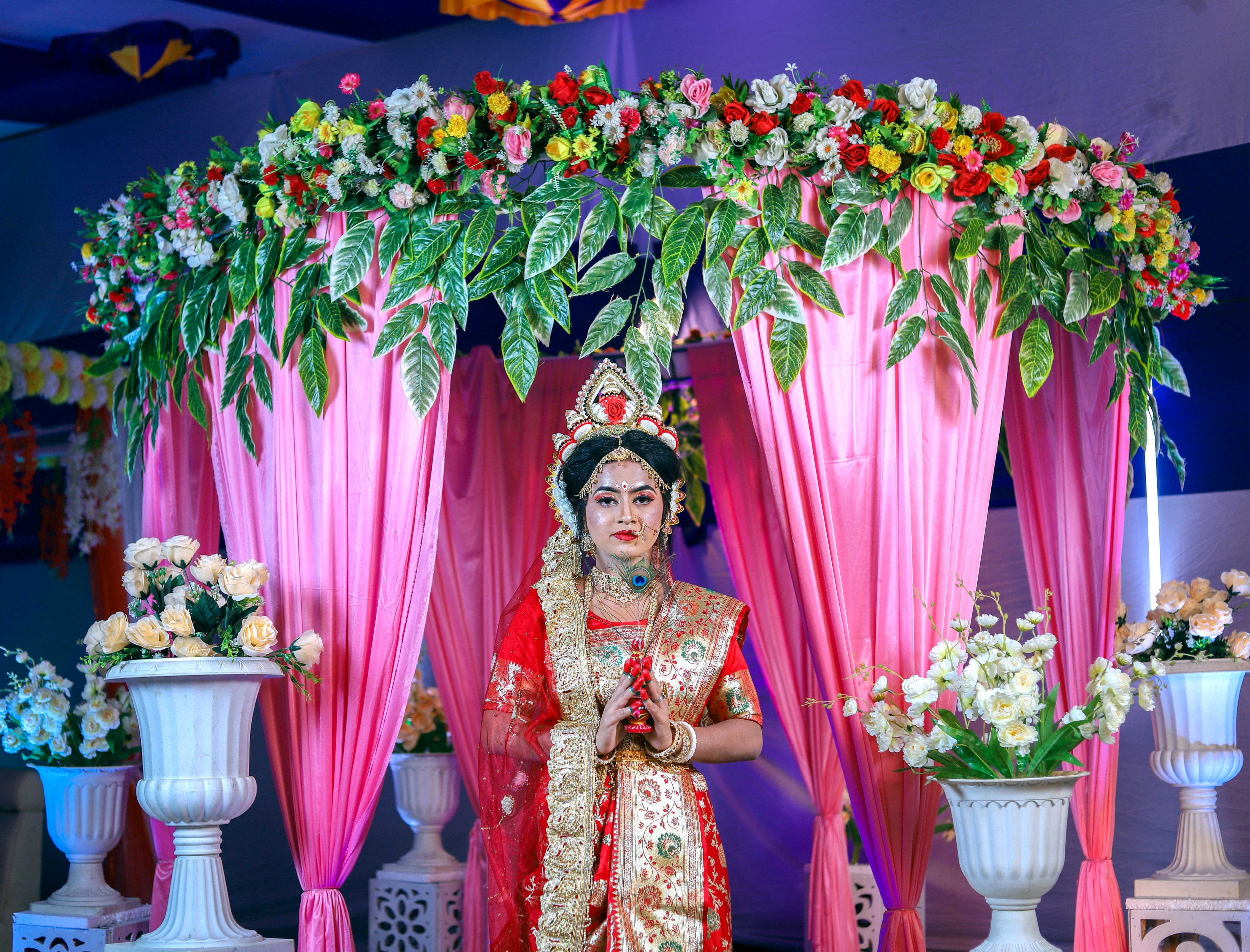 Bride in Traditional Wedding Clothing and with Flowers Decoration ...