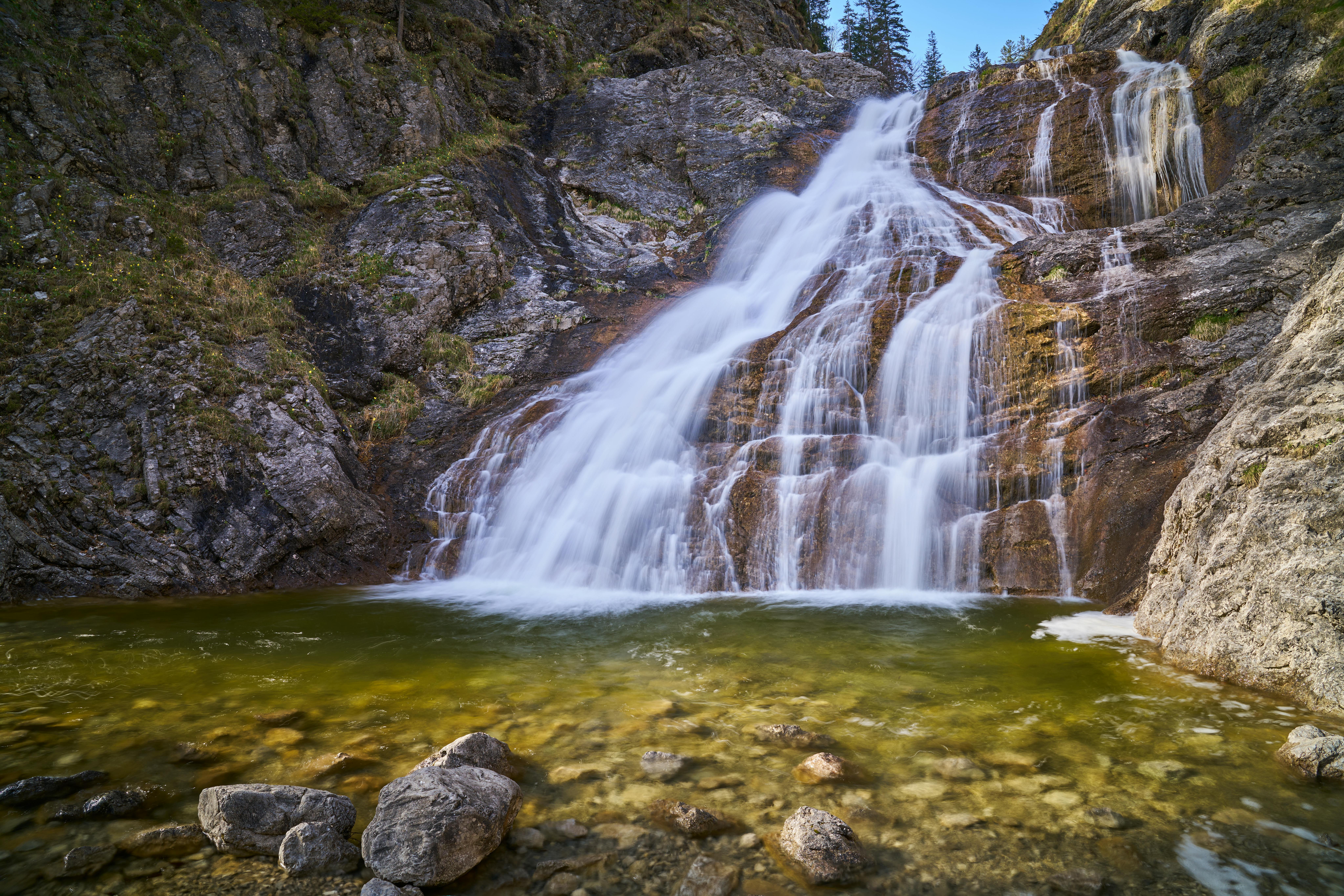 Barren Rocks around Waterfall · Free Stock Photo