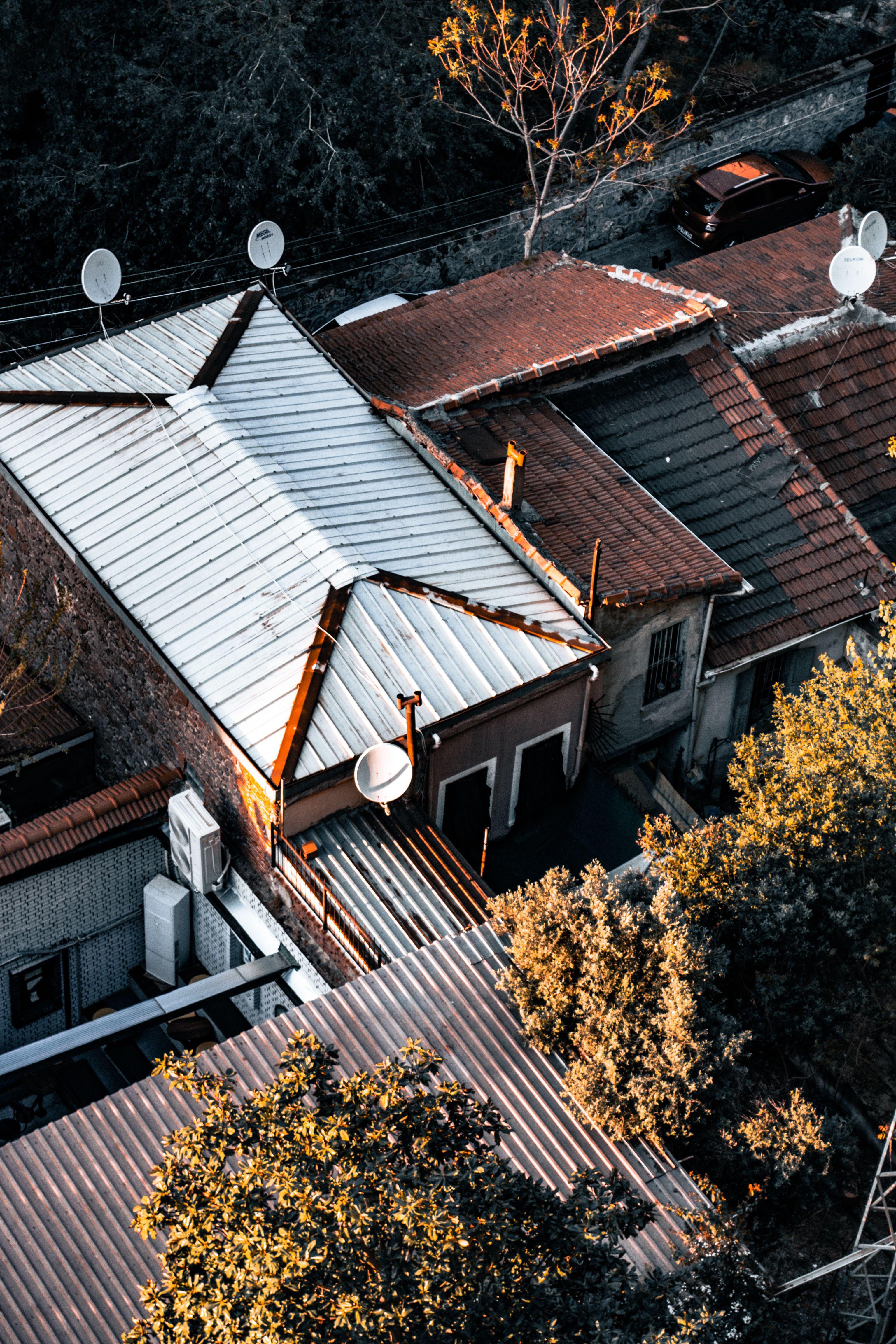 An aerial view of a roof with a satellite dish · Free Stock Photo