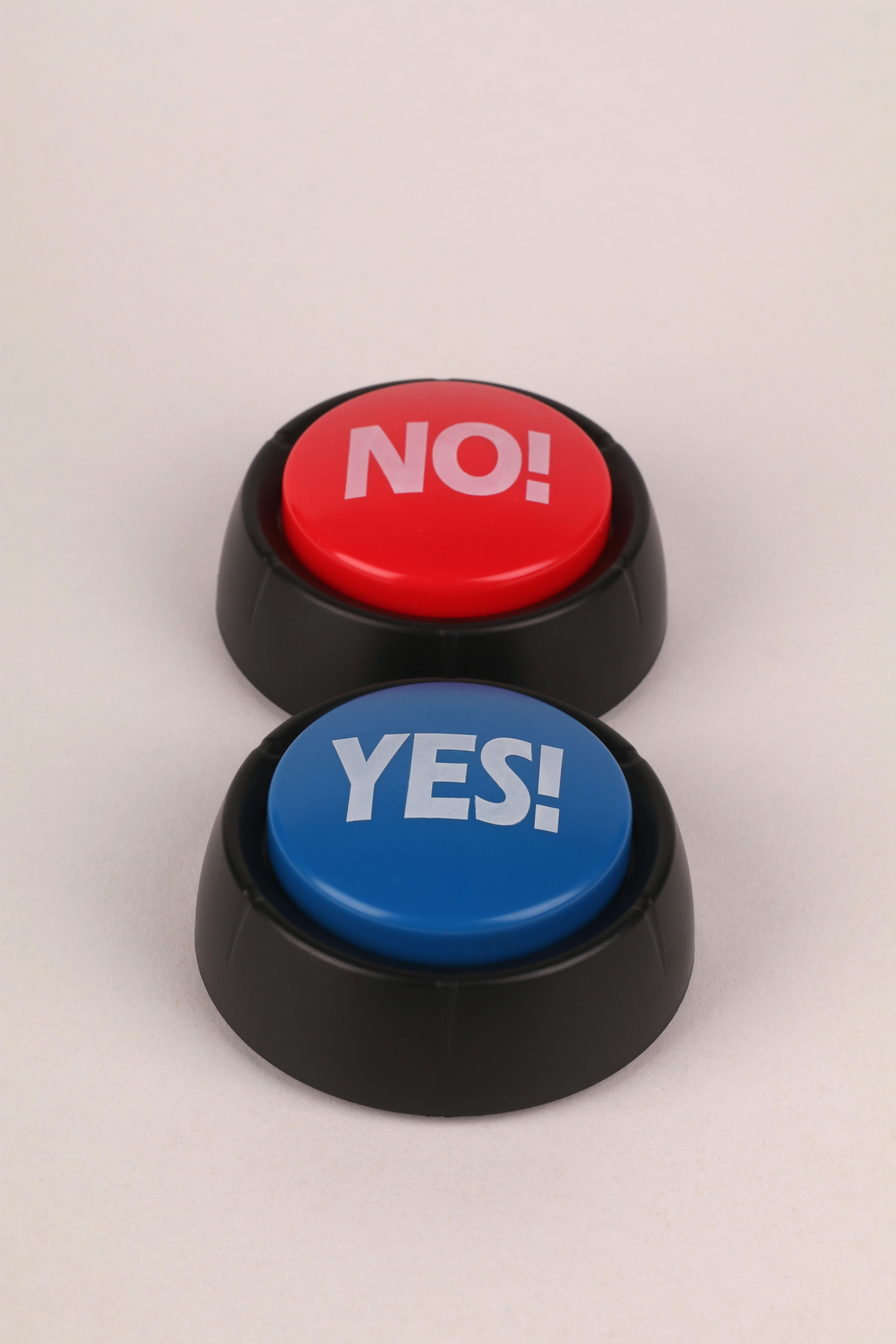 Two red and blue buttons with the word yes and no · Free Stock Photo