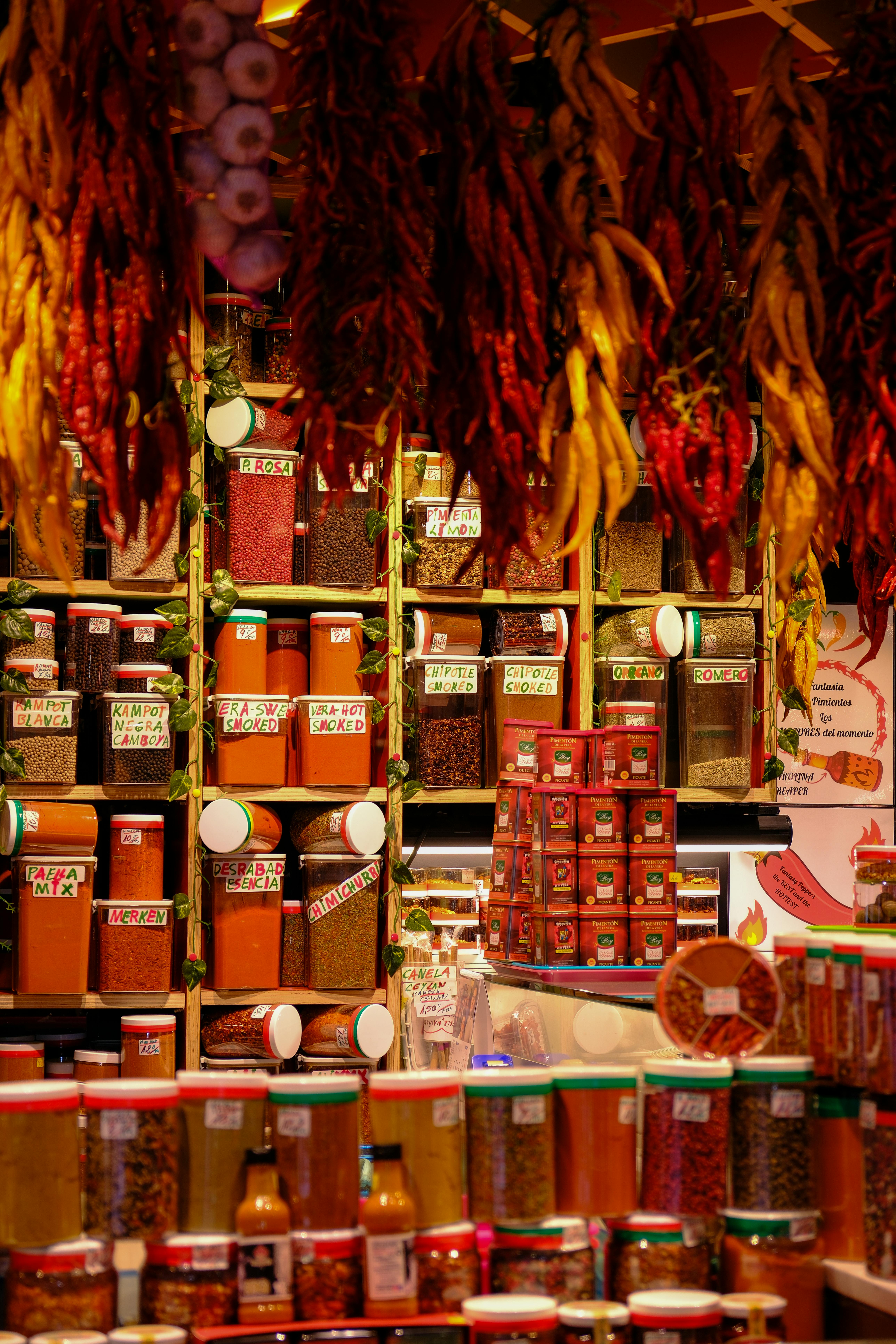 A display of spices and peppers in a store · Free Stock Photo