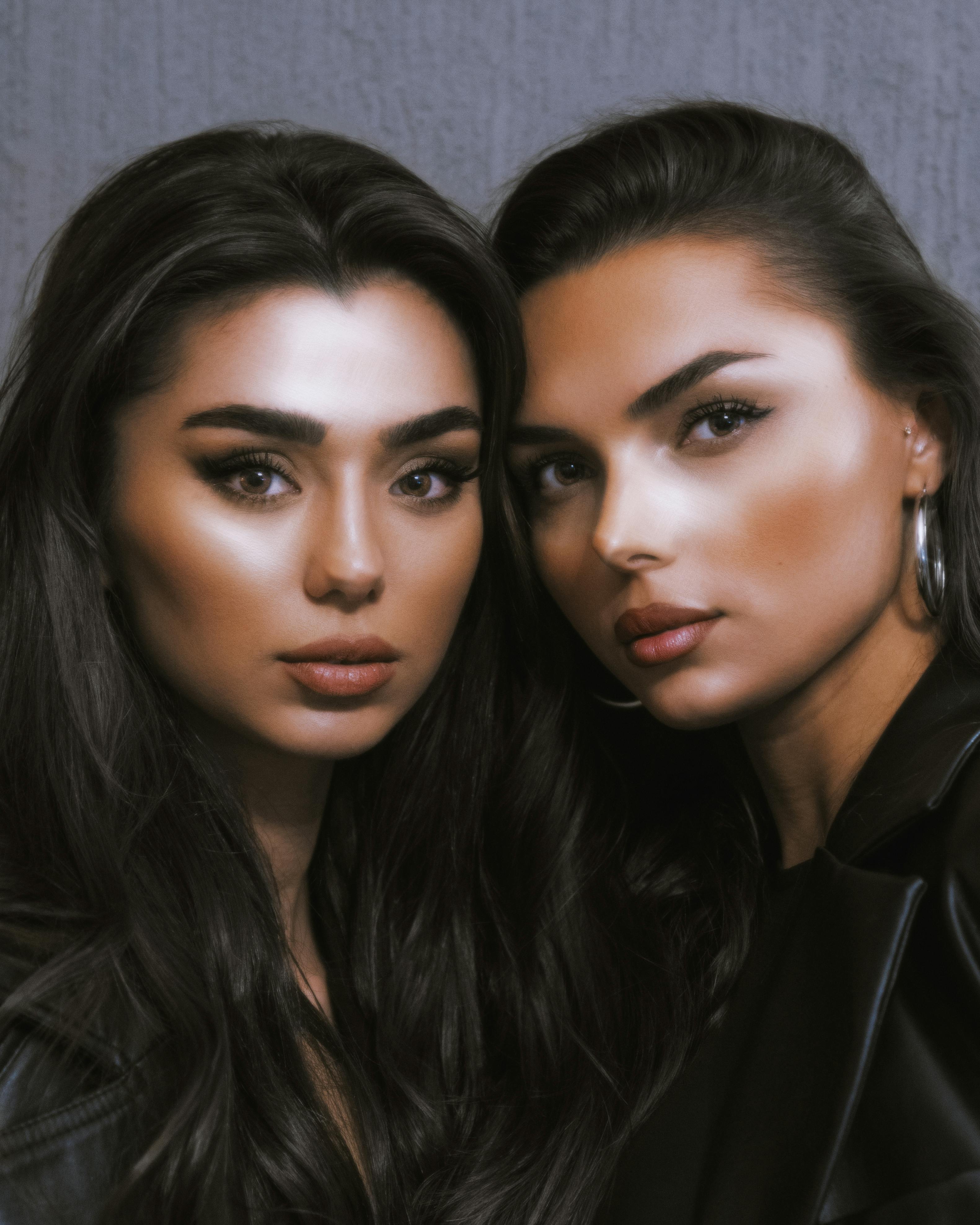 Two women posing for a photo with their makeup · Free Stock Photo
