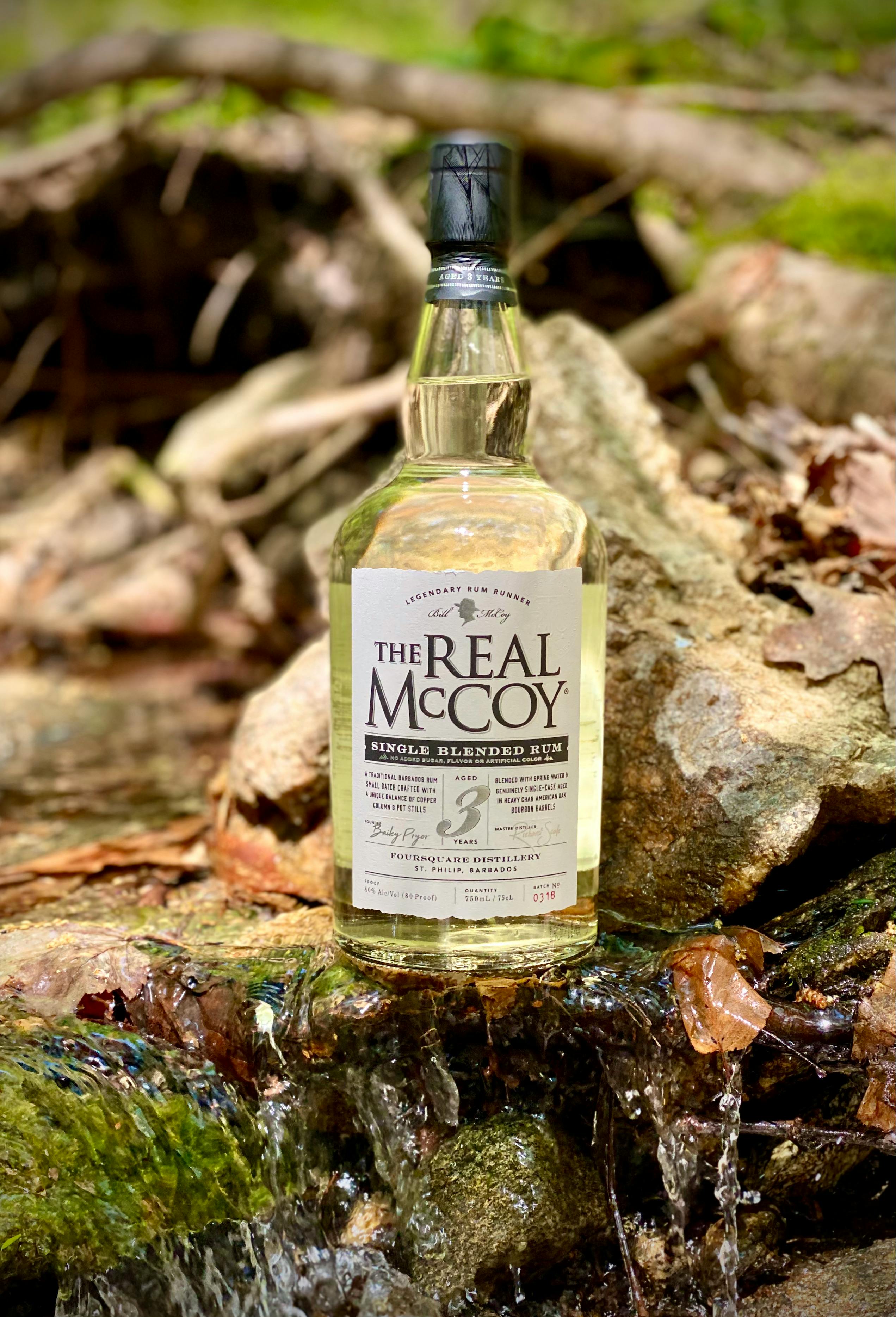 Bottle of Real McCoys Rum atop a Stream · Free Stock Photo