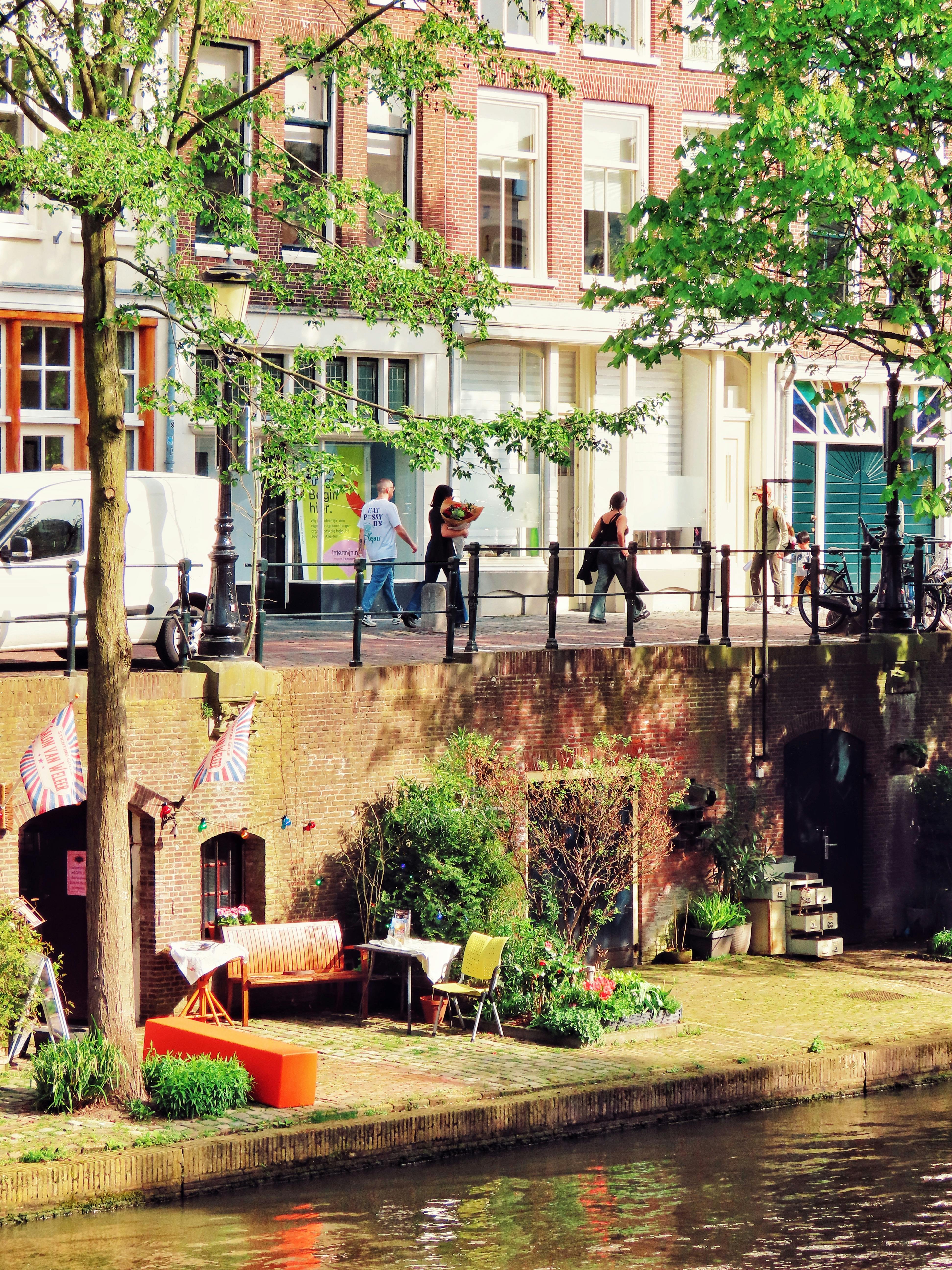 View of Waterfront Buildings and People Walking by the Canal in Utrecht ...