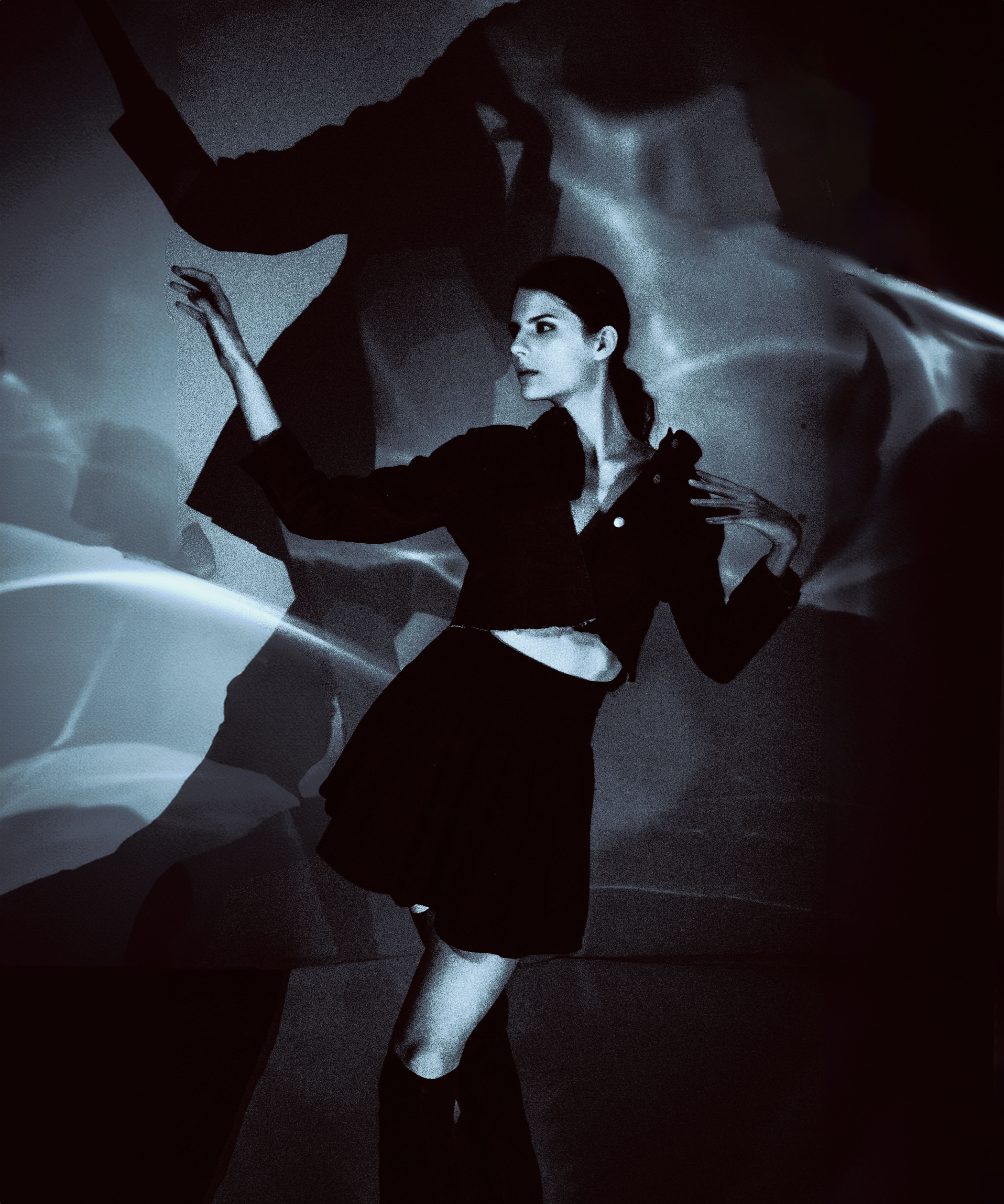 Beautiful Woman in Shirt and Skirt Posing in Beam of Light · Free Stock ...