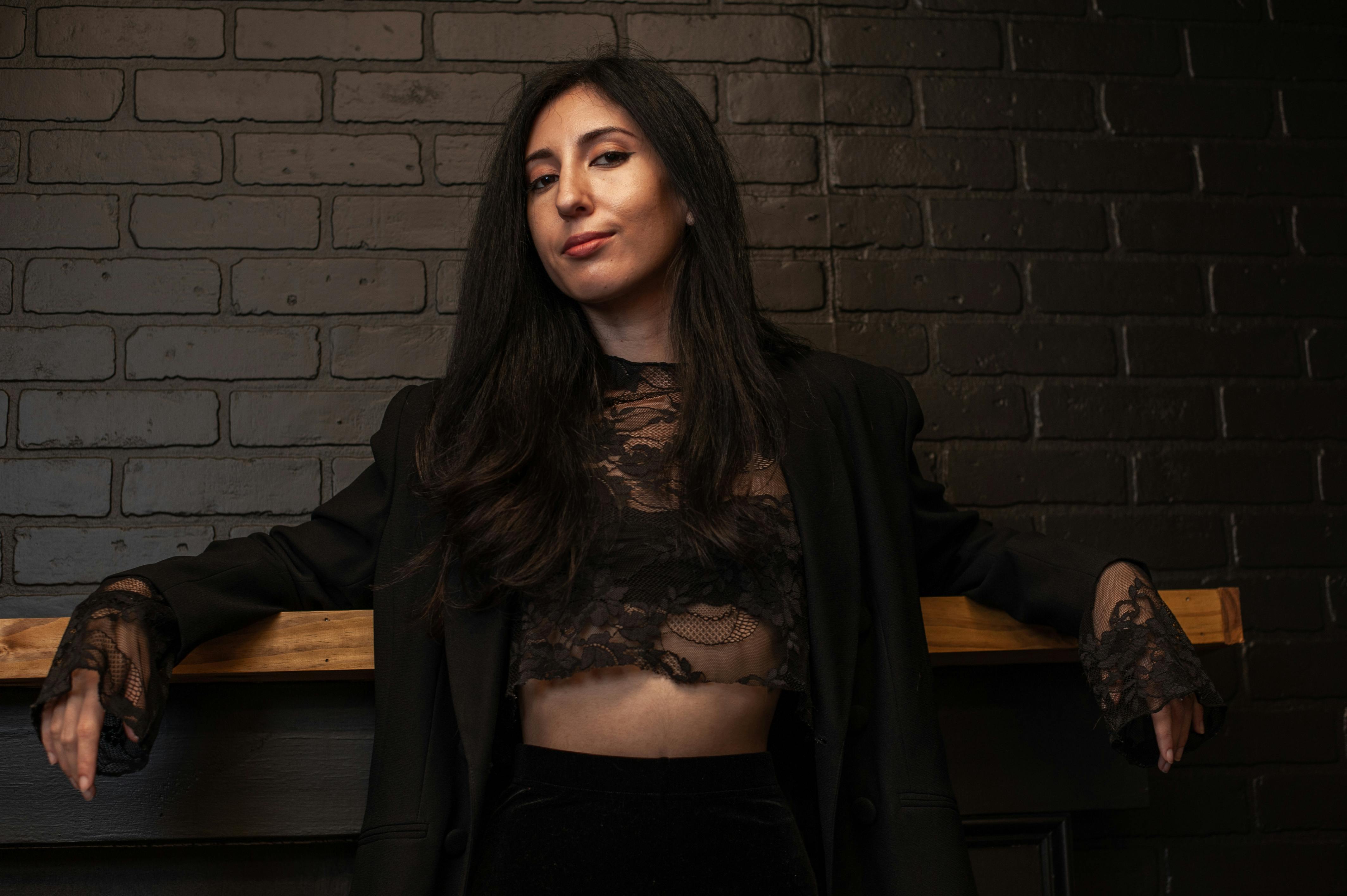 Portrait of a Female Model Wearing a Black Jacket with Lace Cuffs ...