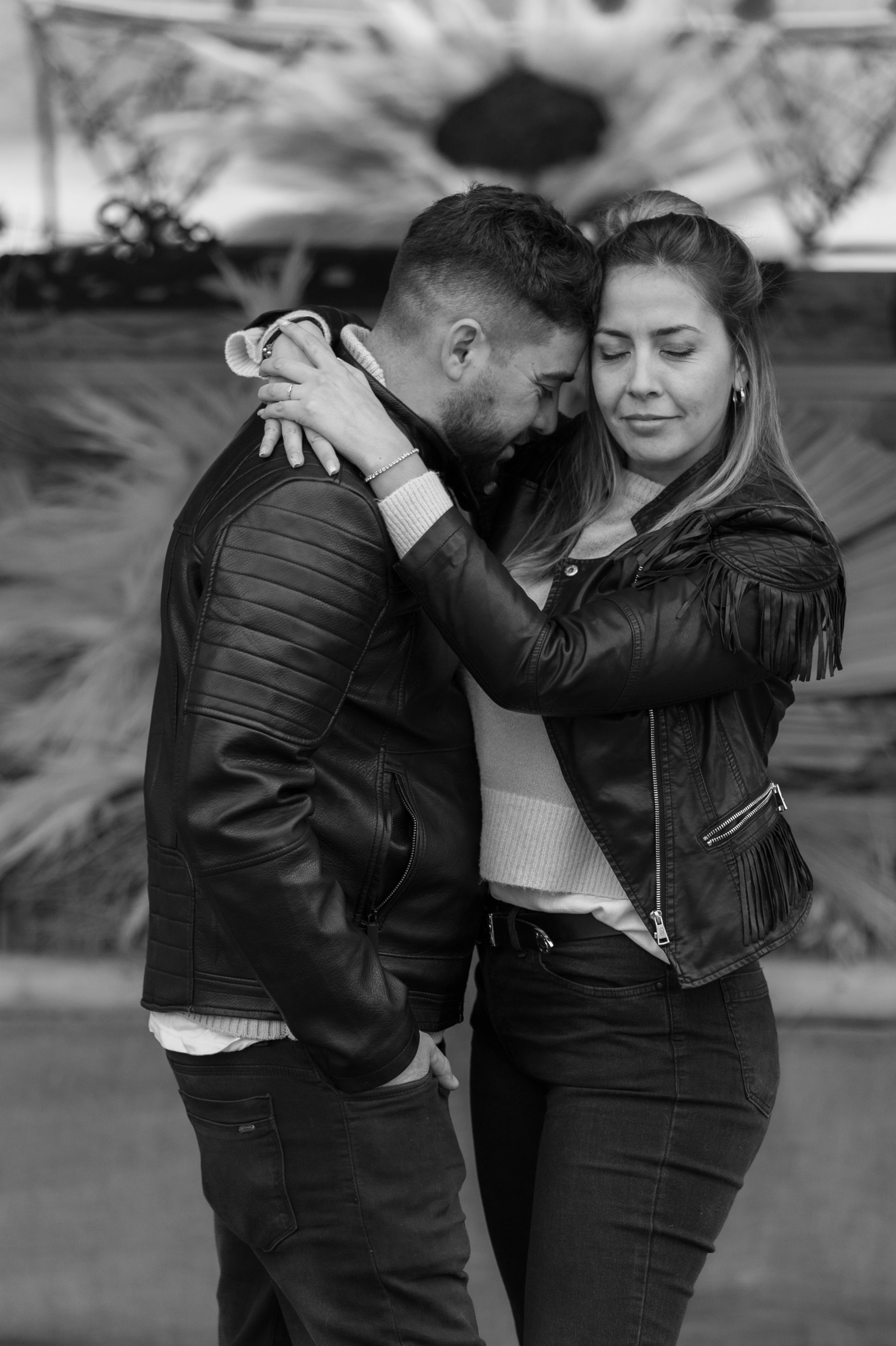 Hugging Couple in Leather Jackets · Free Stock Photo