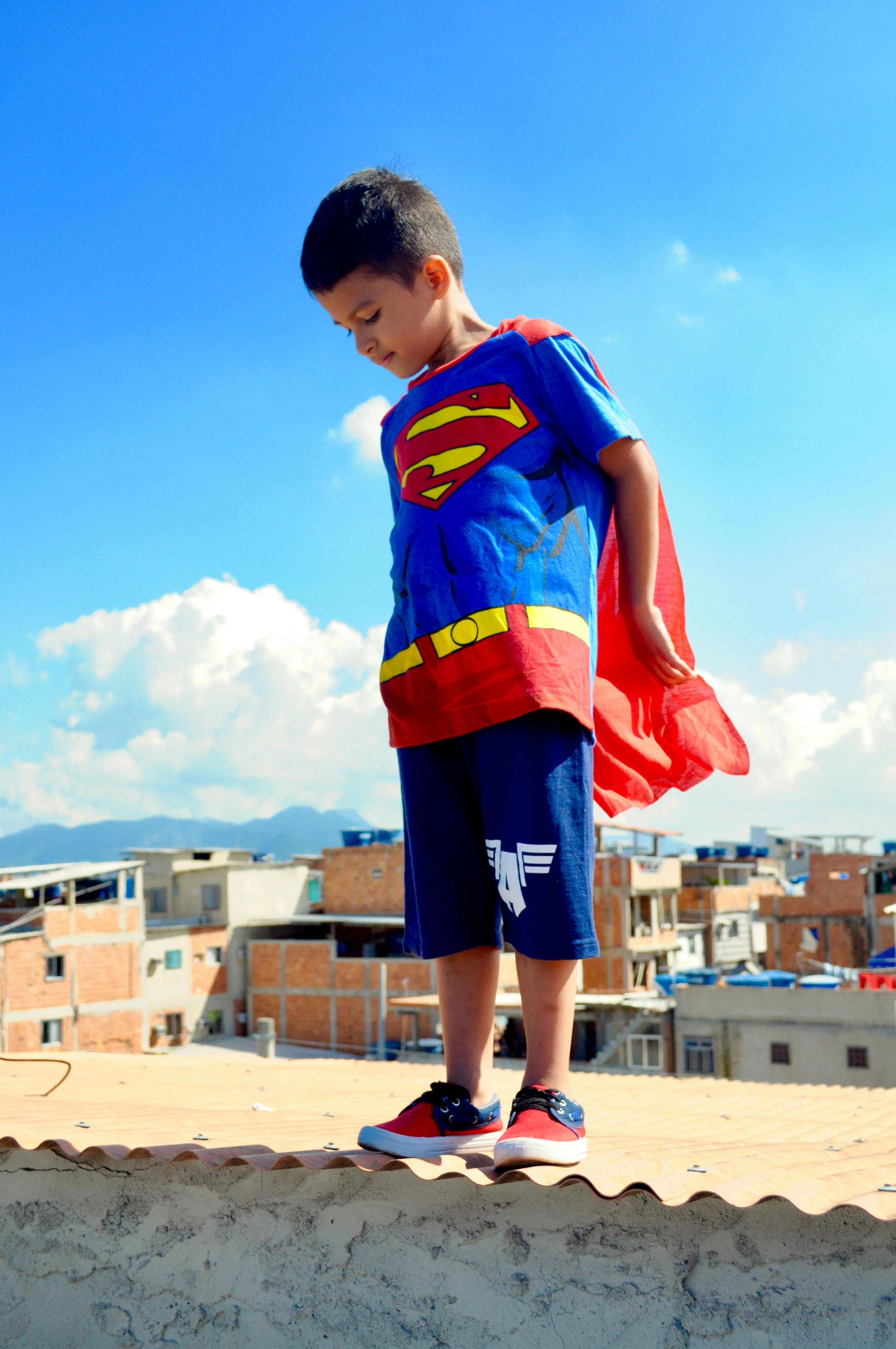 Photo of a Little Boy in a Superman Costume Standing on a Roof · Free ...