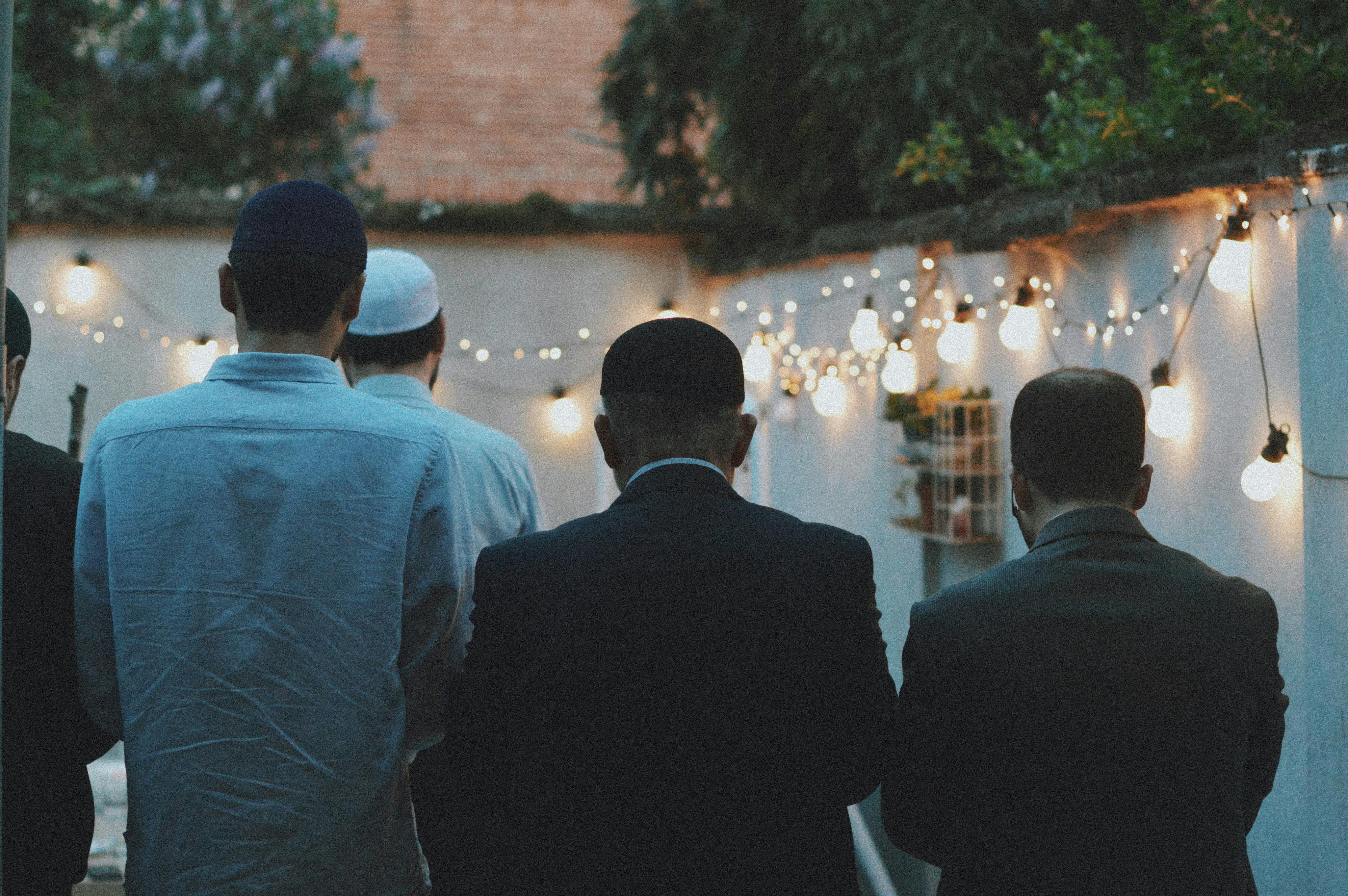Group of Praying Men · Free Stock Photo