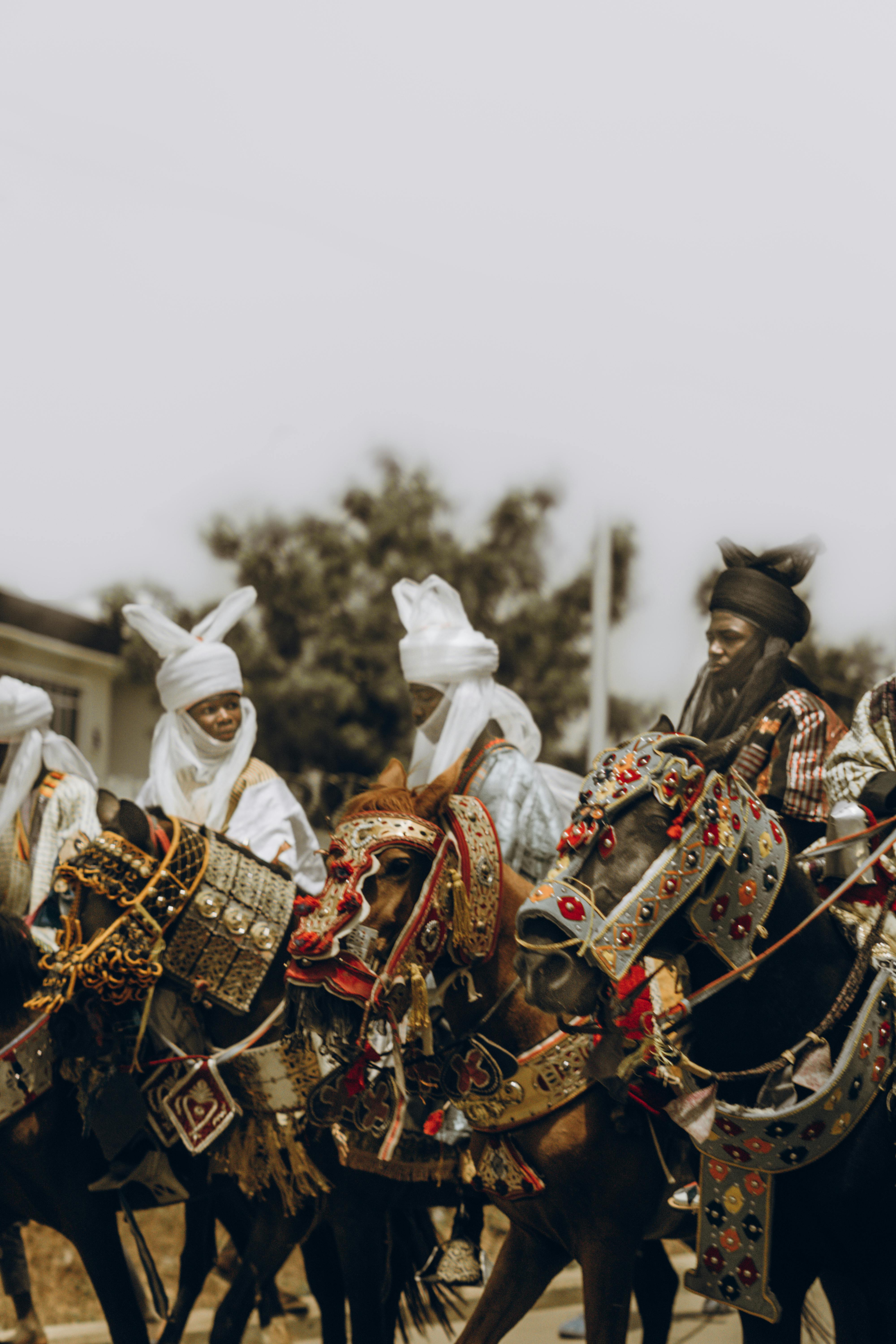 Men in Traditional Clothing Riding Horses in Ornamented Harnesses ...