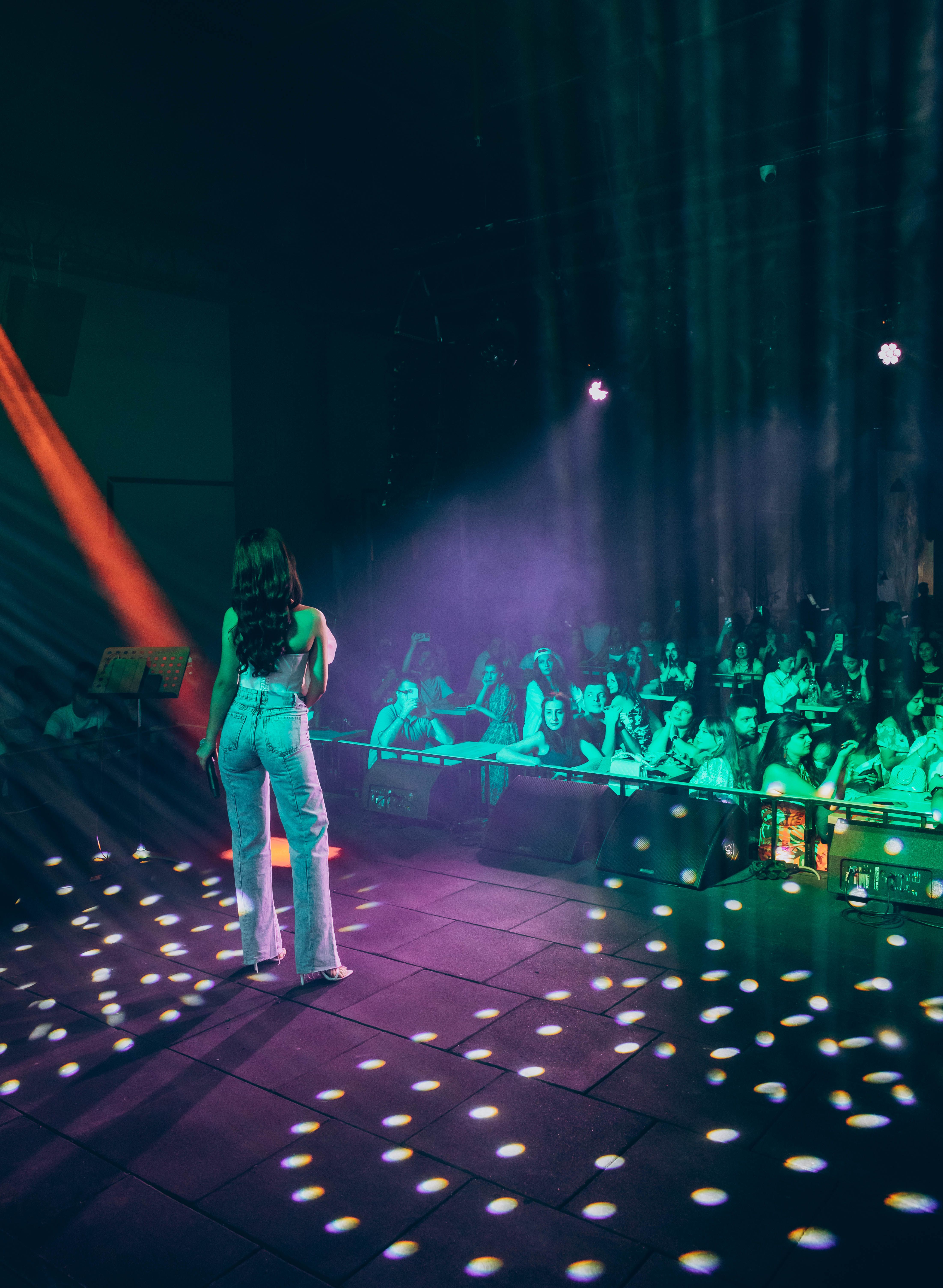 Woman Performing on Stage · Free Stock Photo