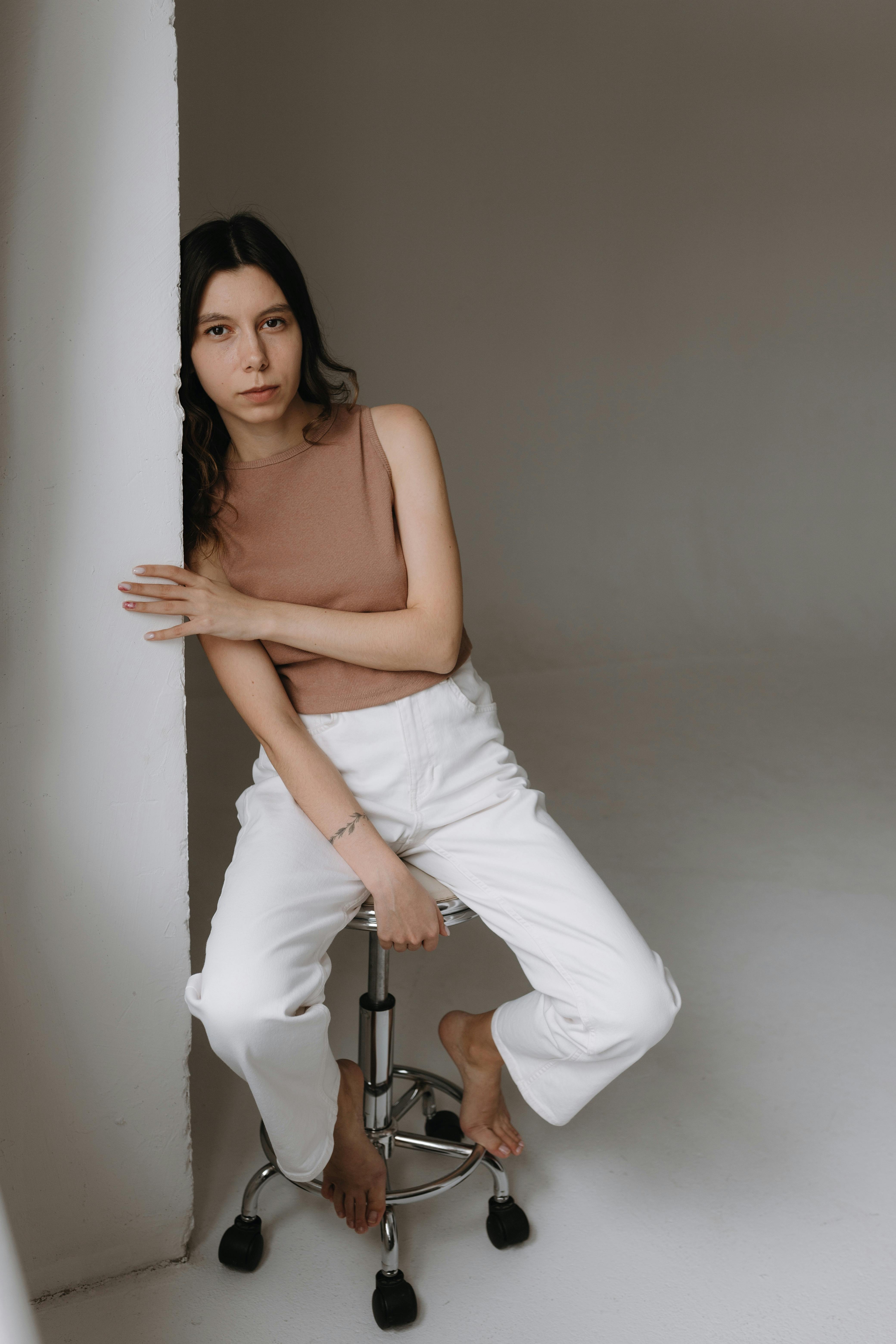 A Woman Sitting on Floor Hugging Leg · Free Stock Photo