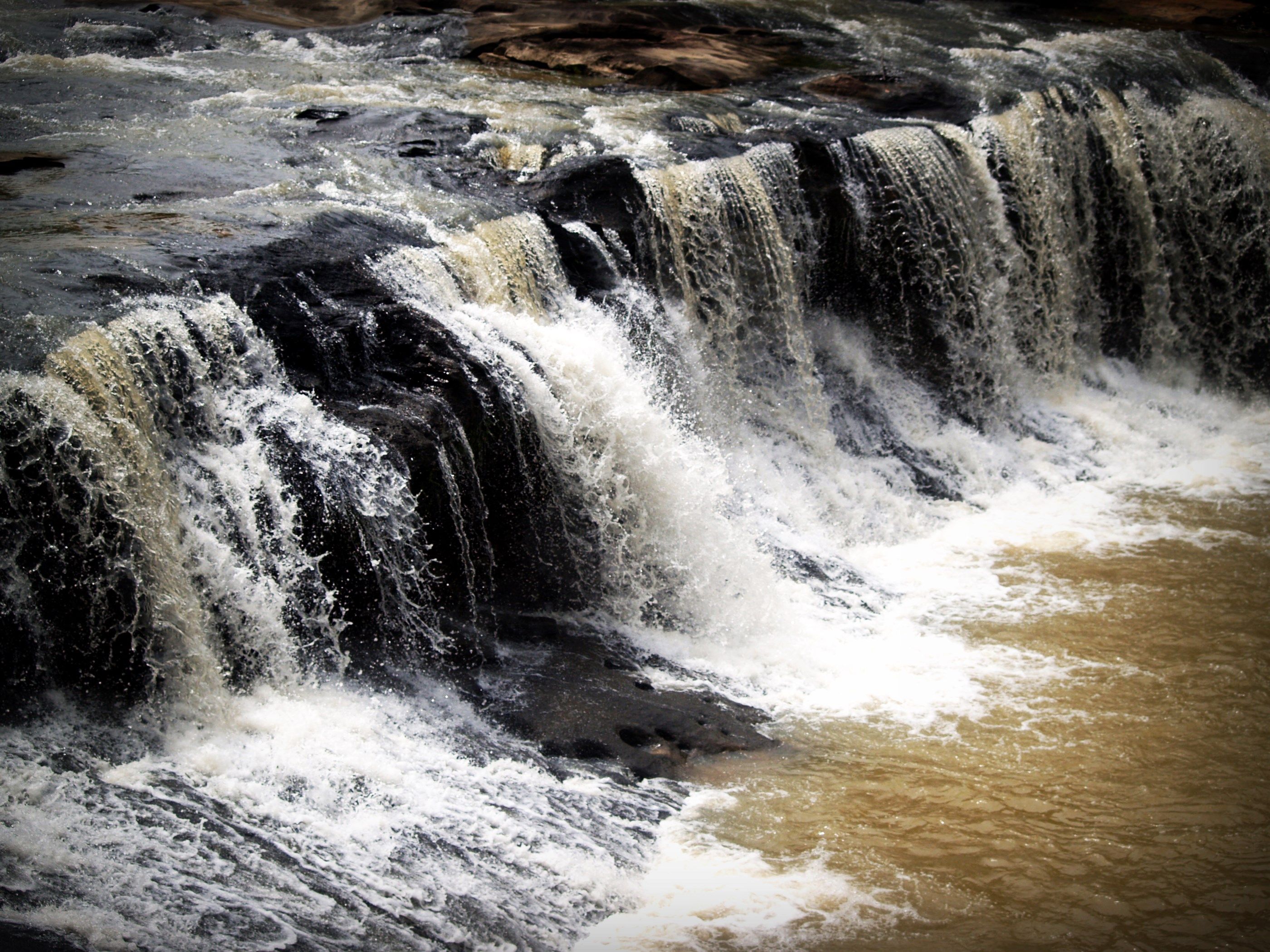 Waterfalls Flowing on Brown Rock Formation Towards River · Free Stock Photo