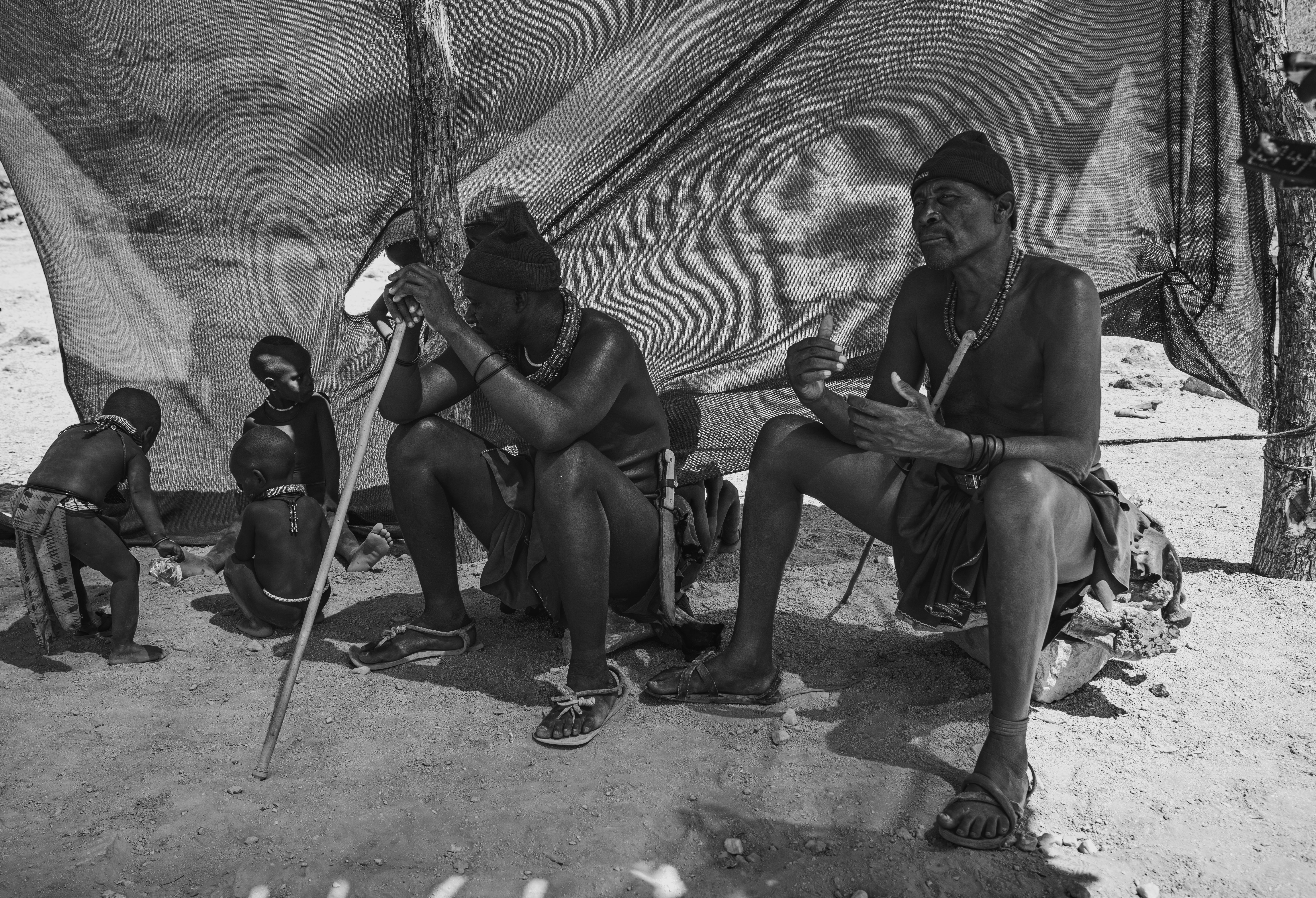 Tribal Men Sitting Next to Little Children in Village · Free Stock Photo