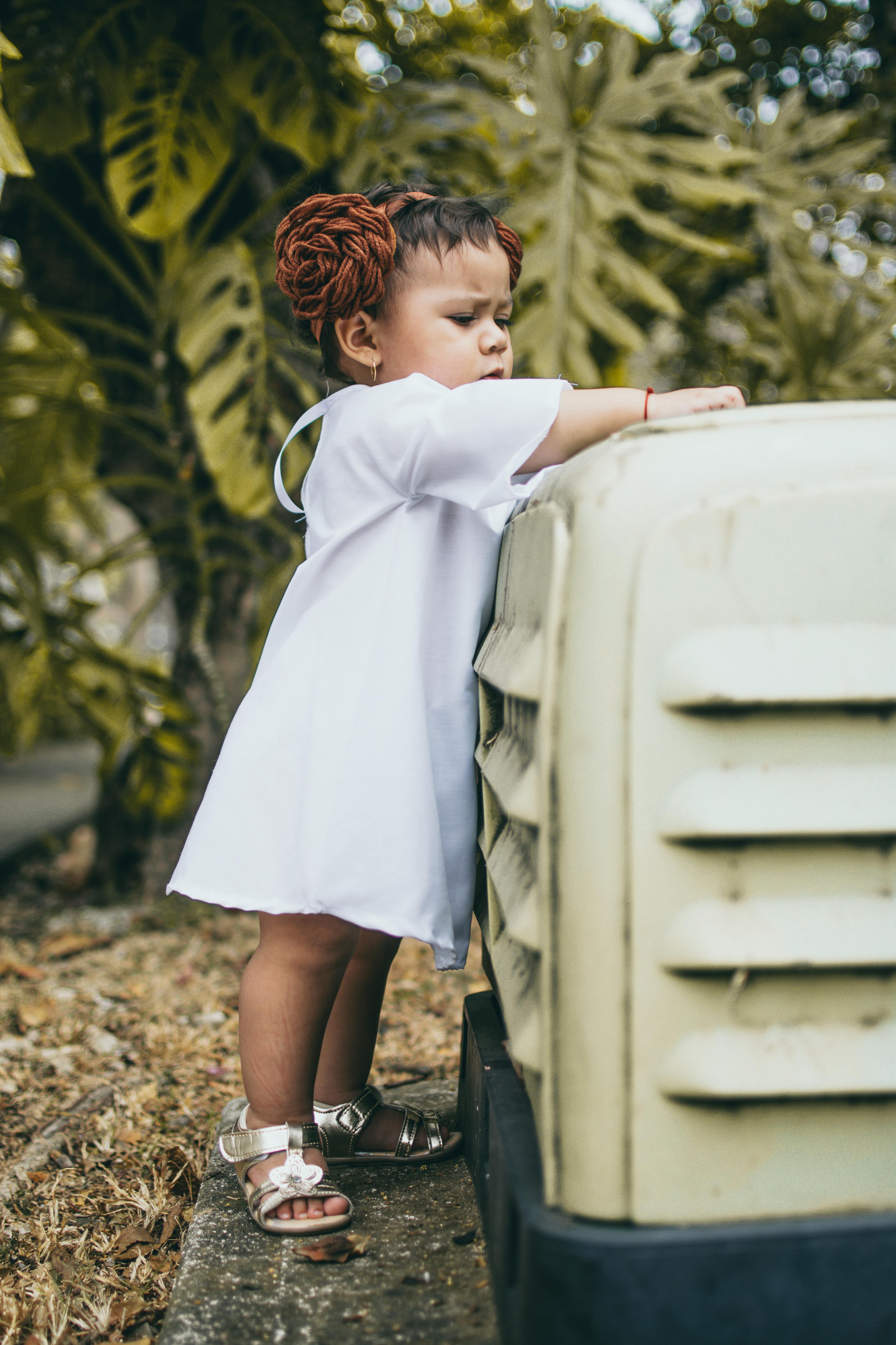 Girl Holding Yellow Machine · Free Stock Photo