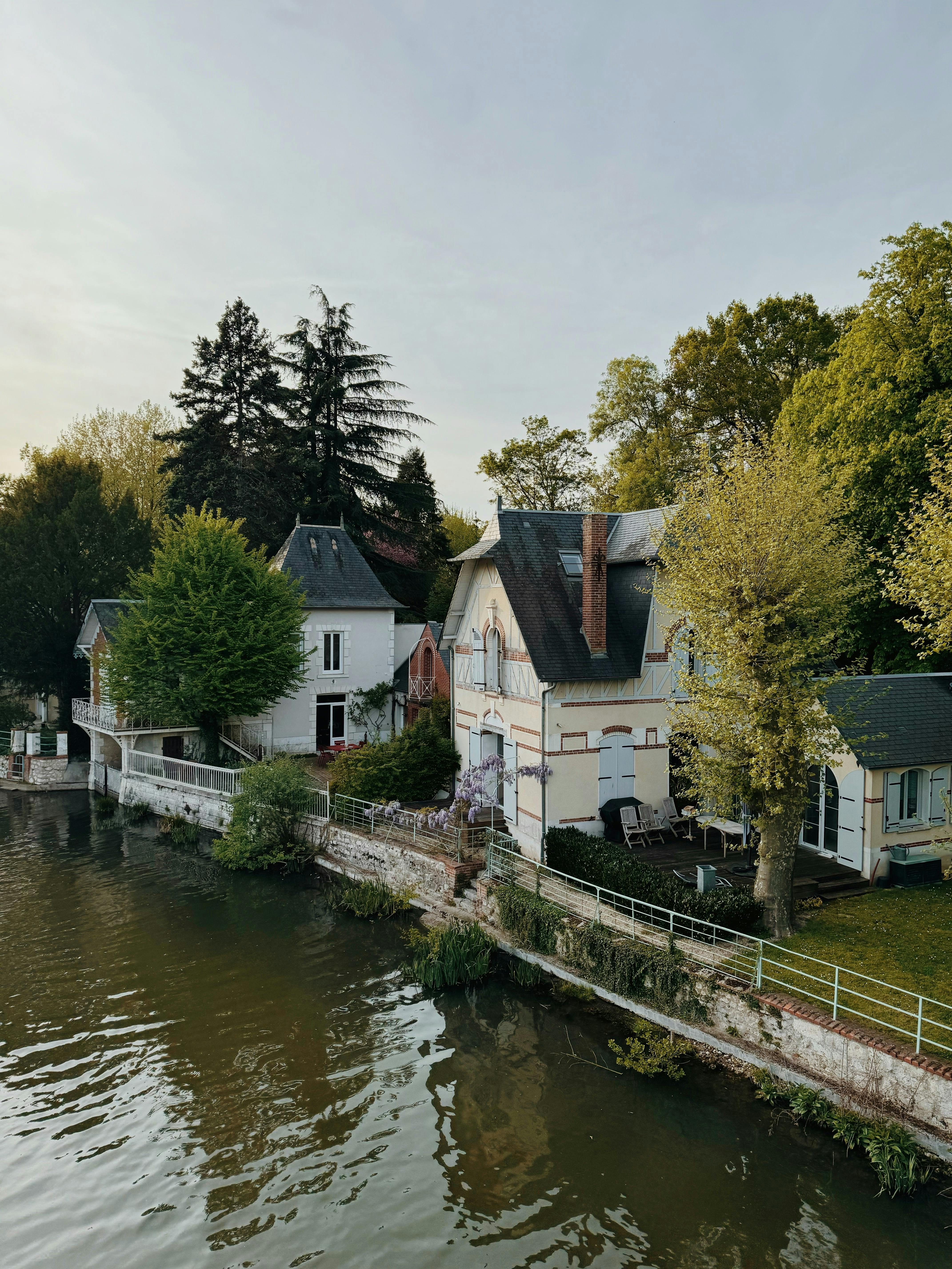 Houses by River in Village · Free Stock Photo
