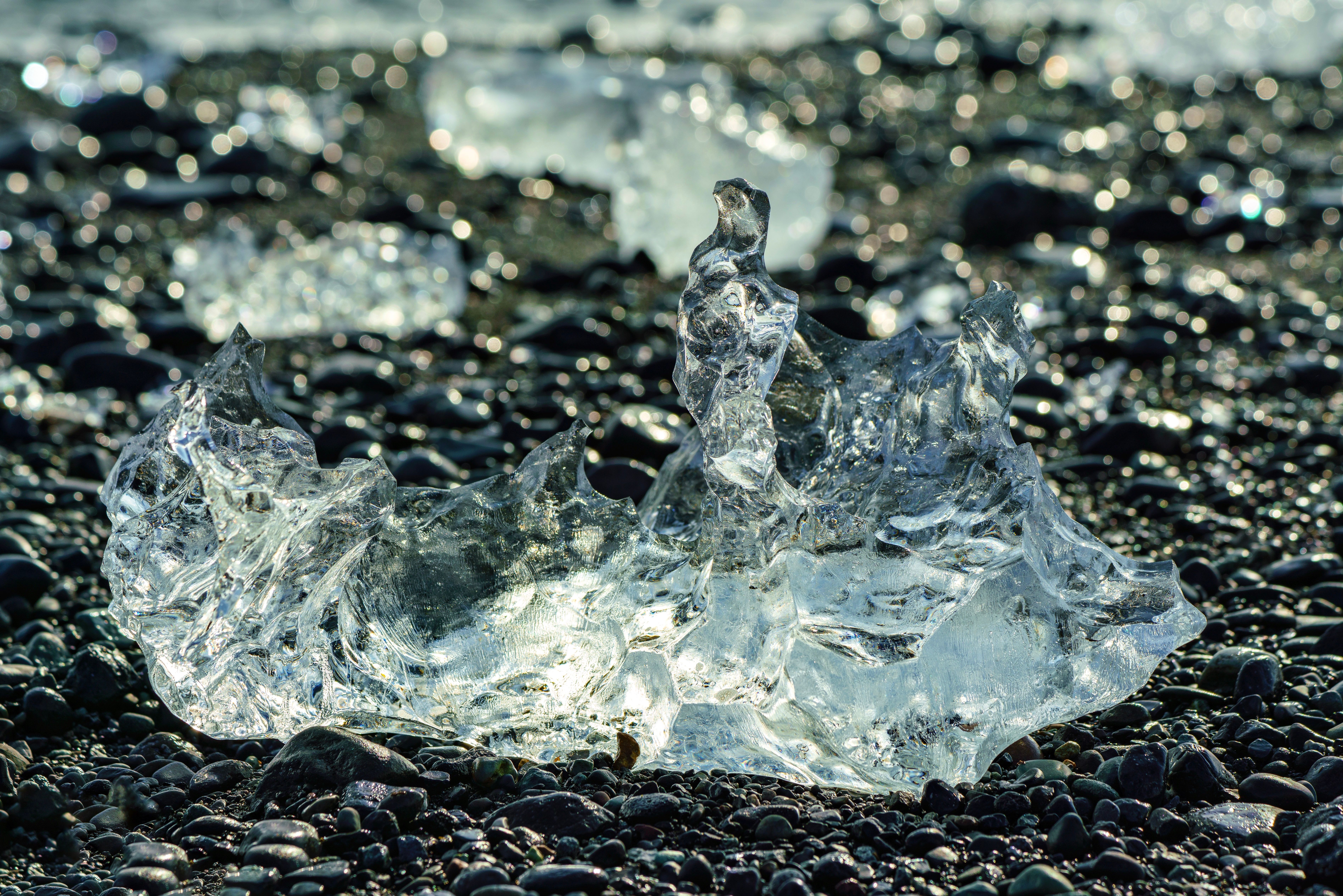 Close-up of a Clear Piece of Ice on a Beach · Free Stock Photo