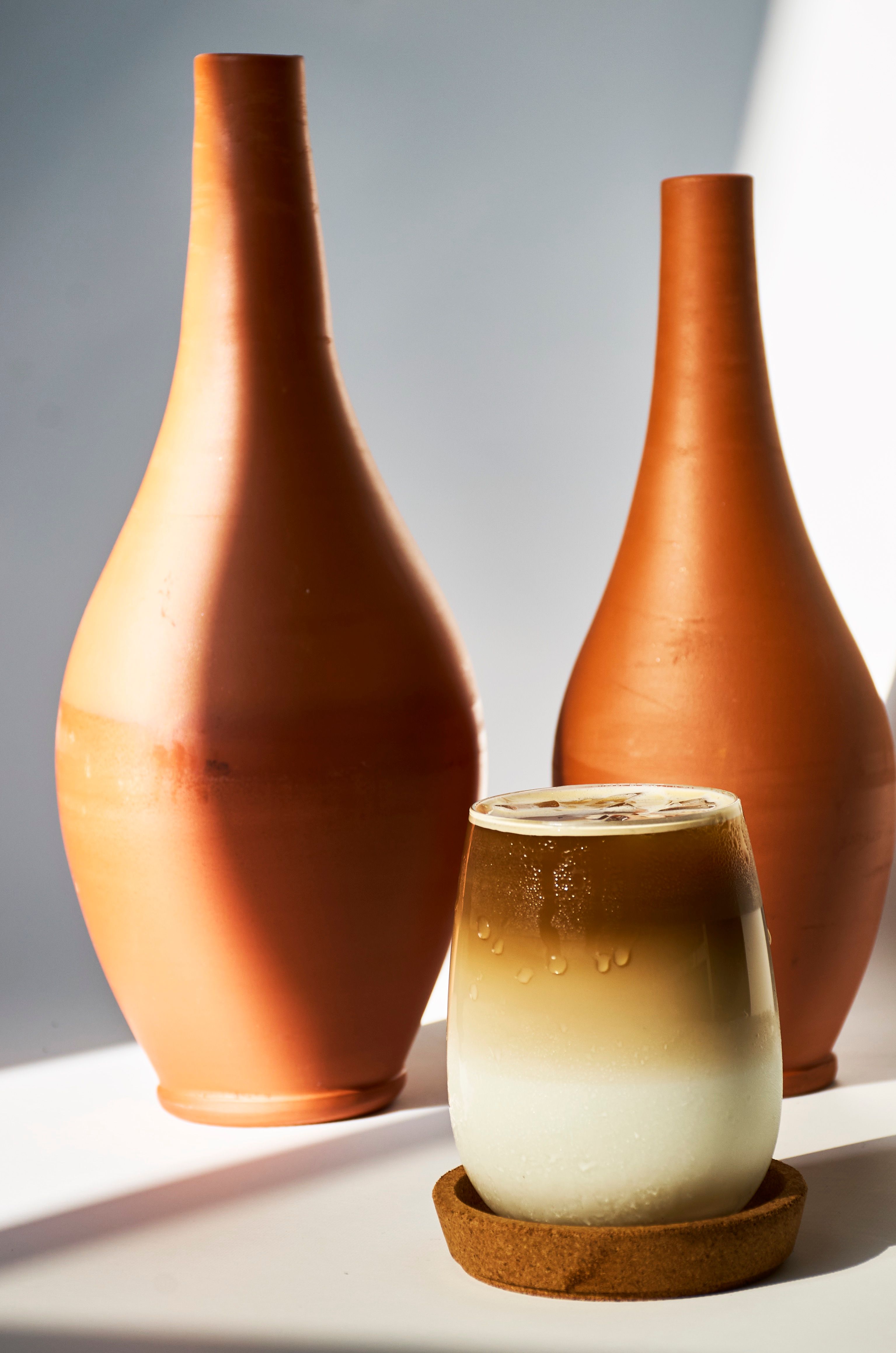 Close-up of Vases and a Glass of Iced Coffee · Free Stock Photo
