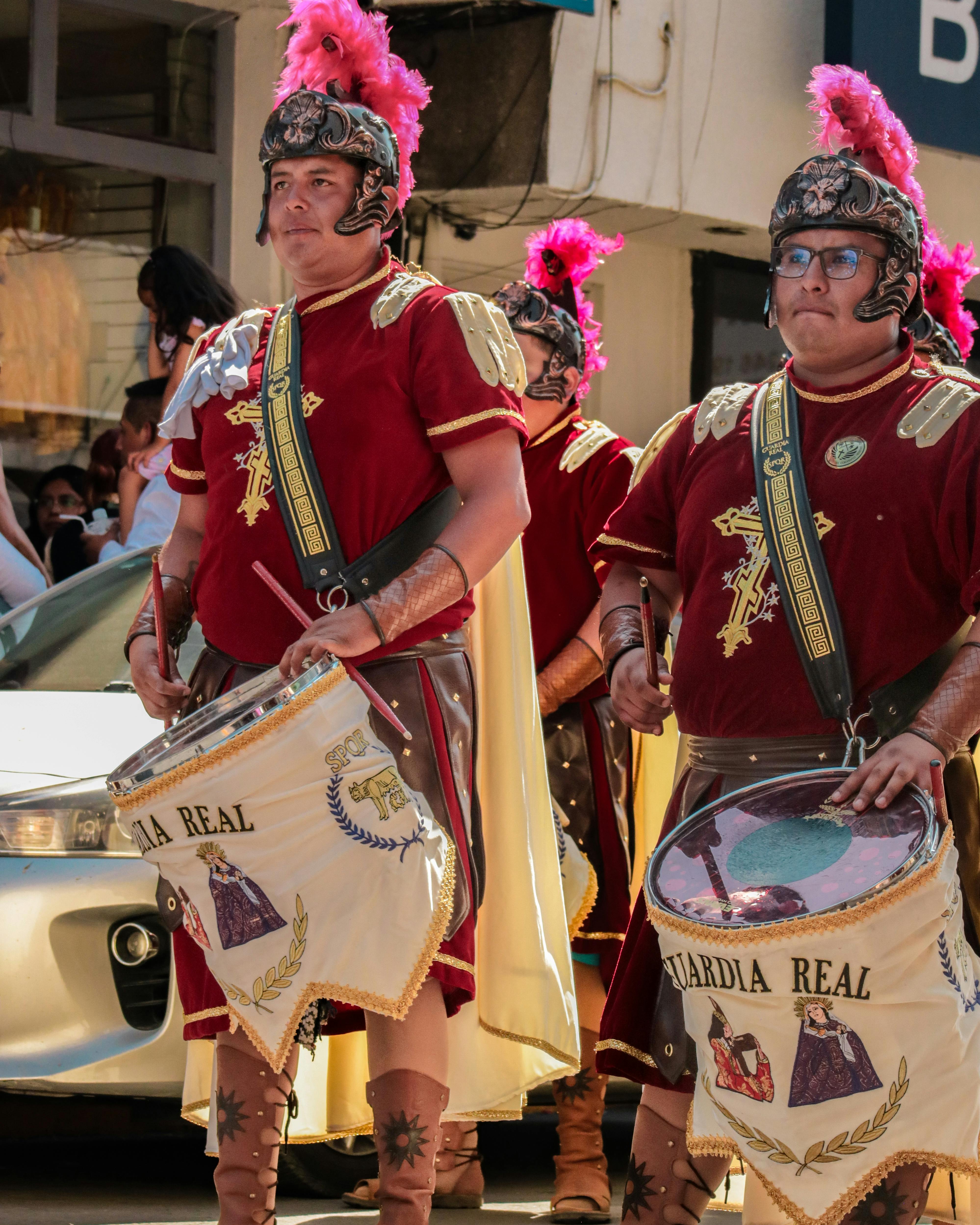 Two men in roman costumes with drums on the street · Free Stock Photo