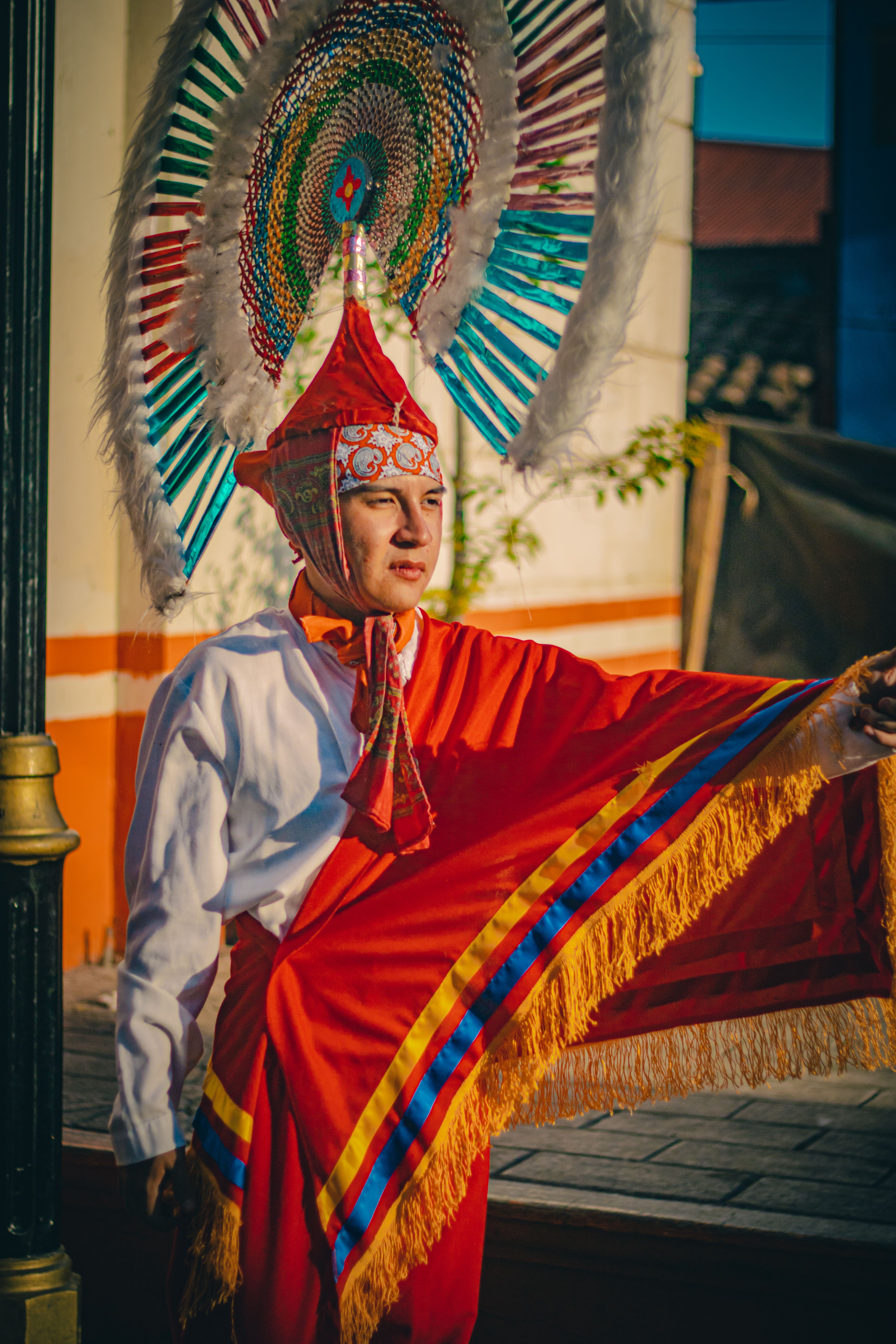 A Quetzal Dancer in Traditional Clothing at a Festival · Free Stock Photo