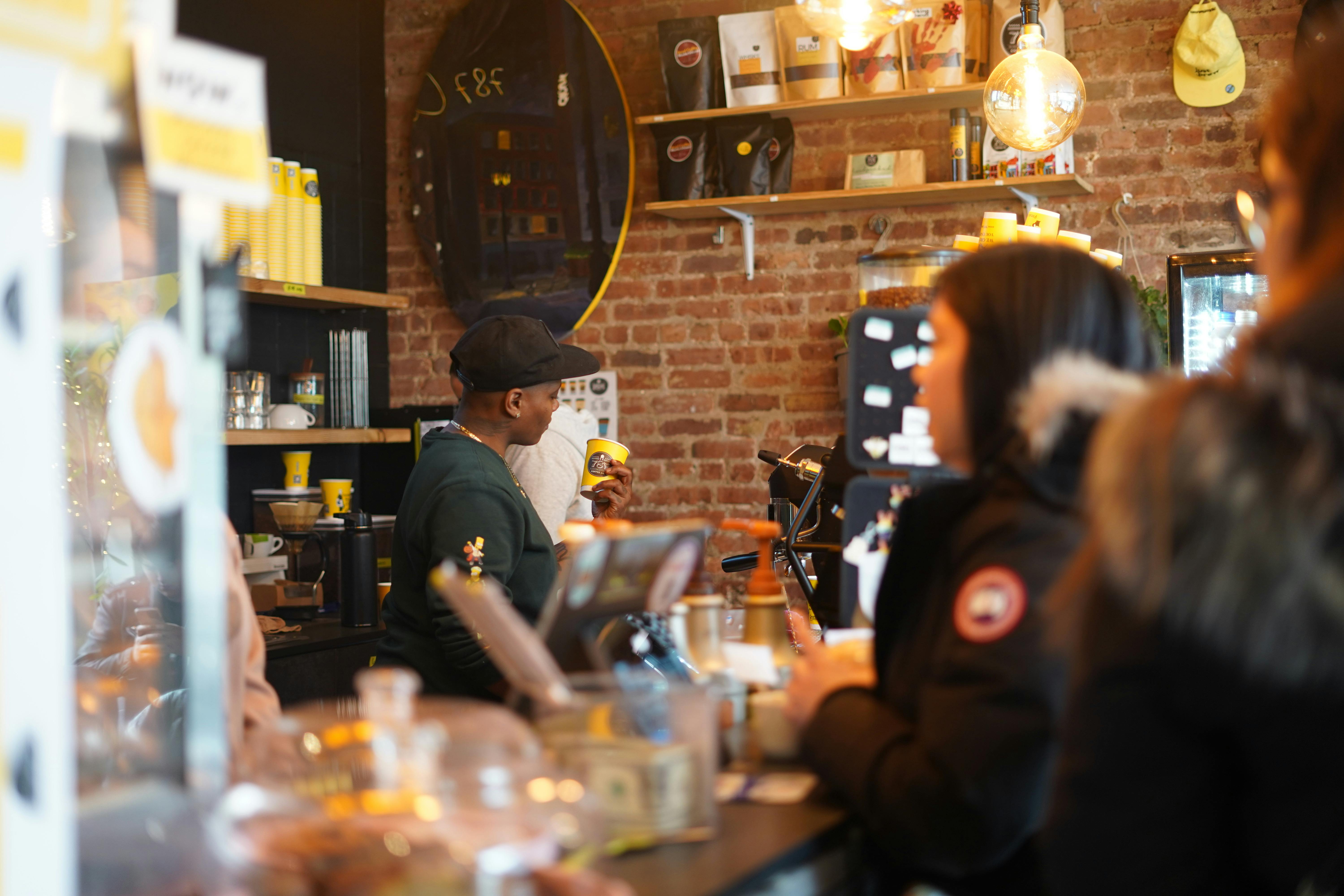 People Waiting in Line at Coffee Shop · Free Stock Photo