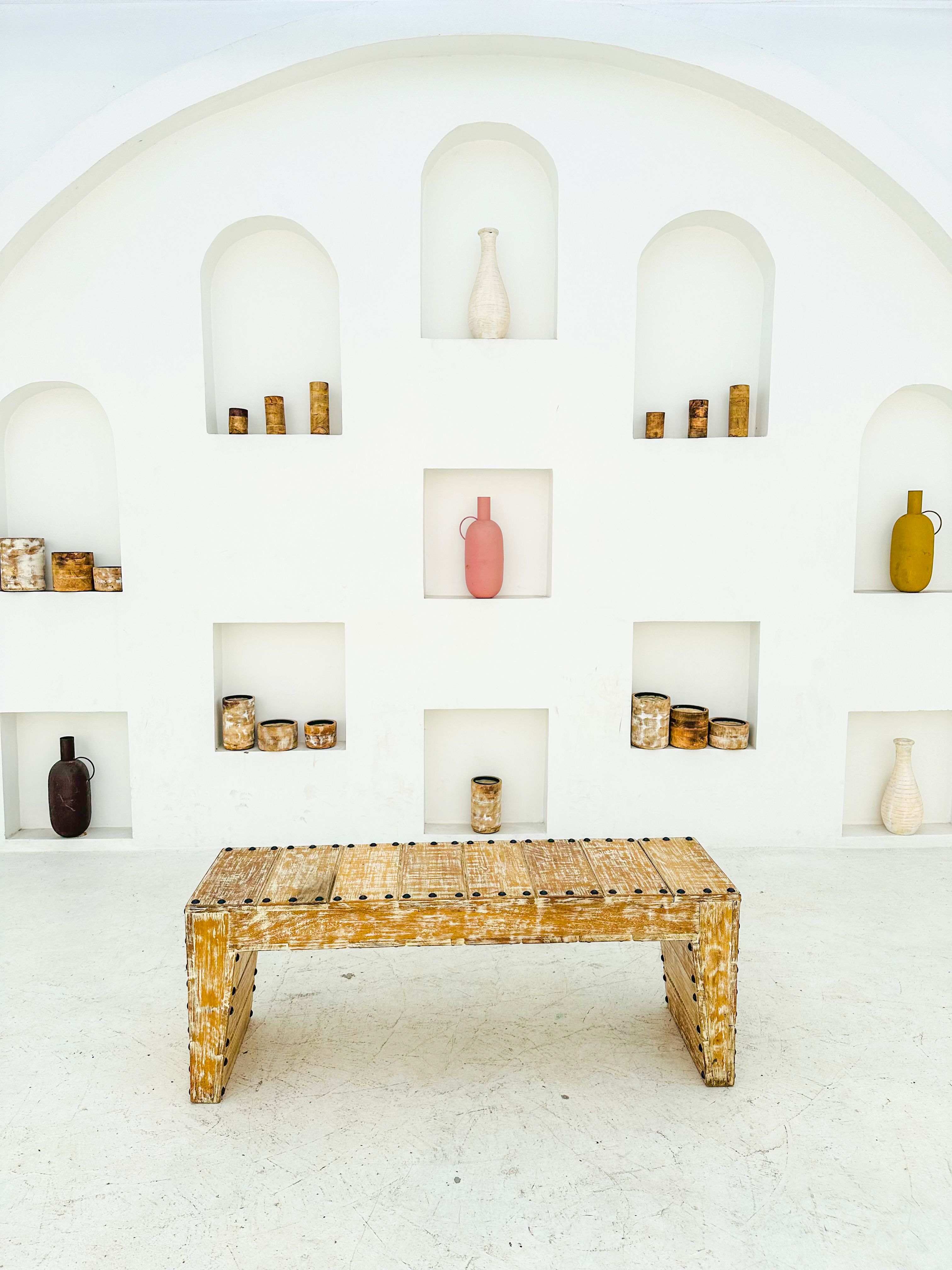 Bench in Front of a Wall with Arched Niches Decorated with Clay Pottery ...