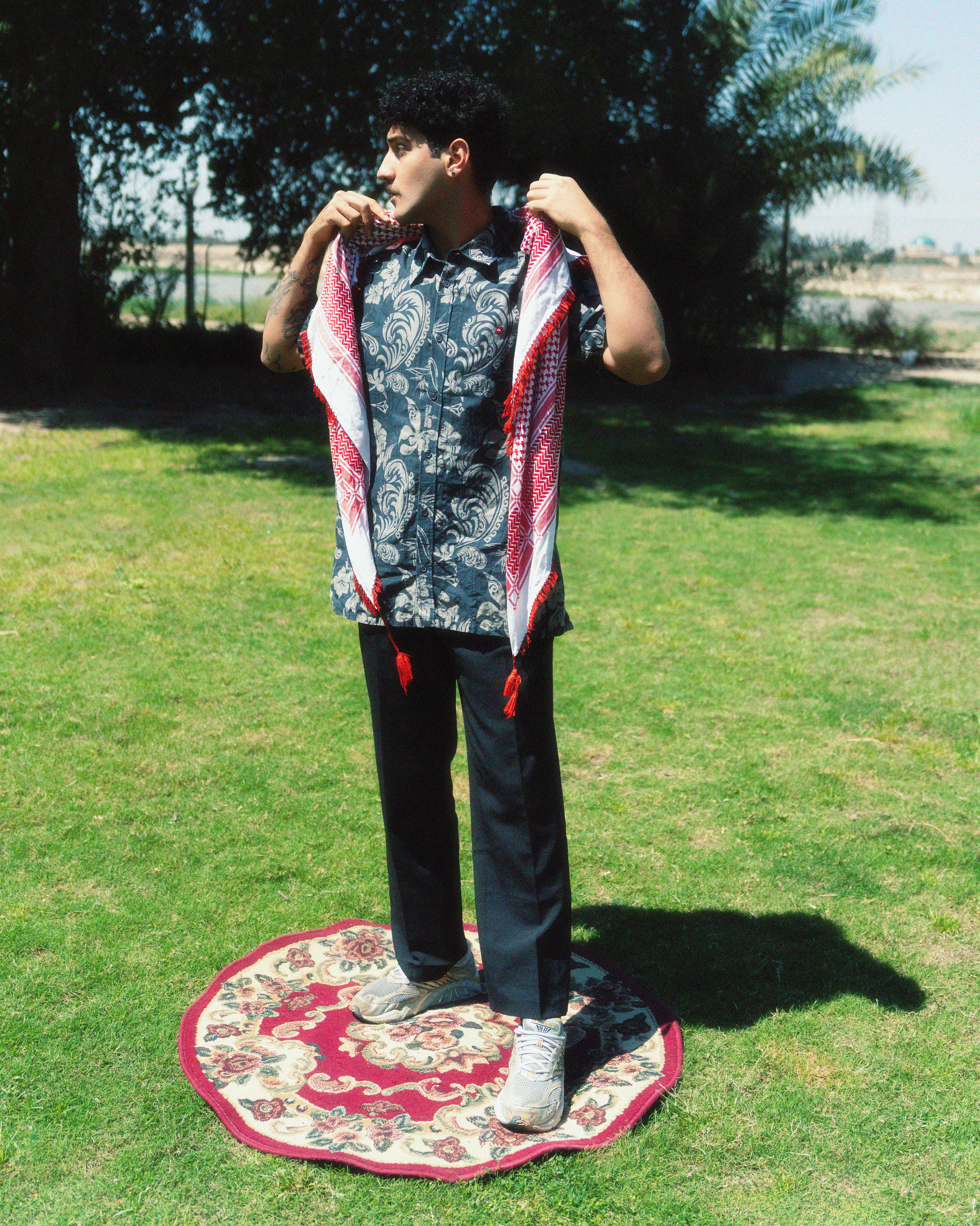 Man Standing on Carpet on a Meadow · Free Stock Photo