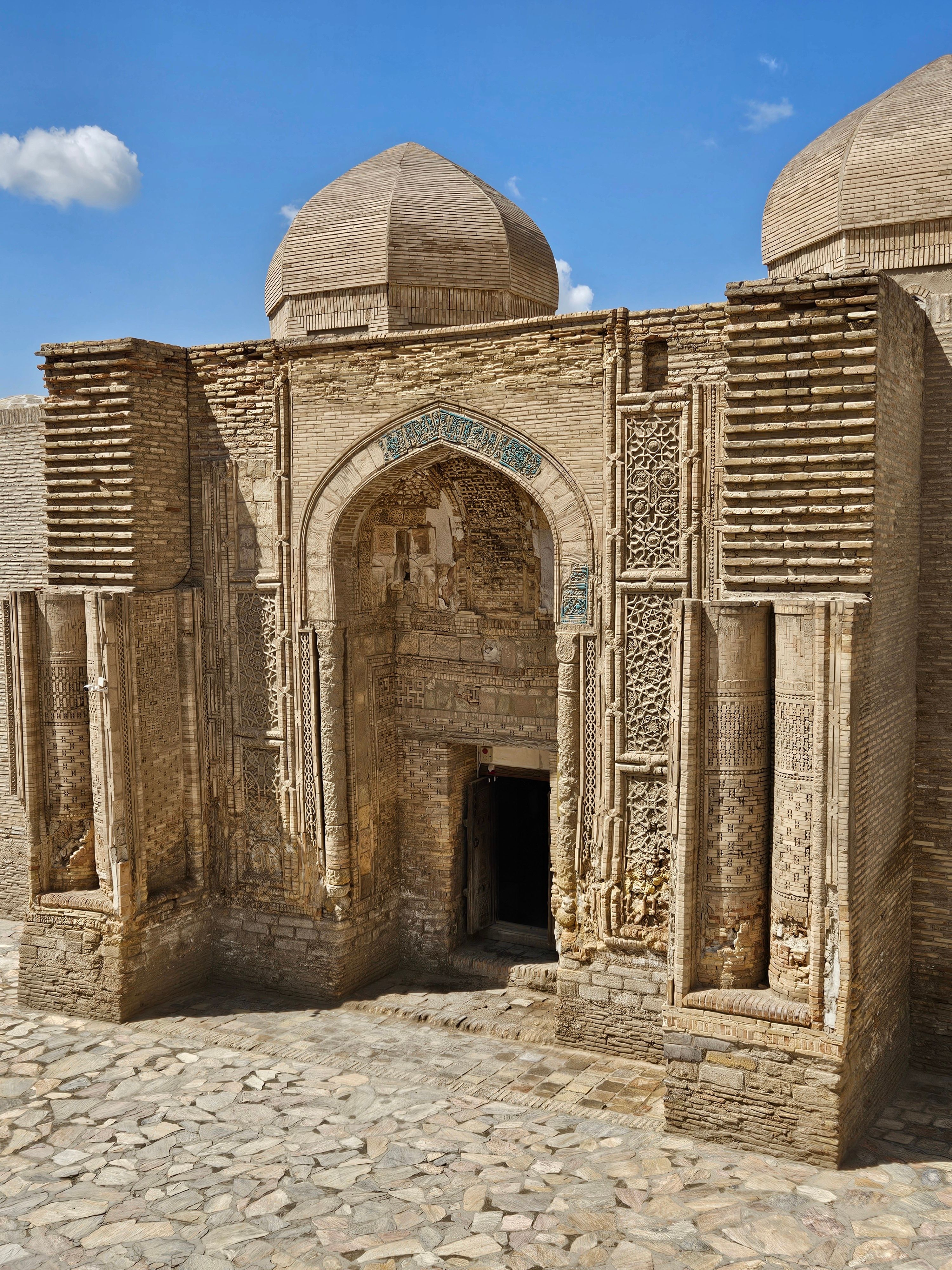 The entrance to a building with two domes · Free Stock Photo