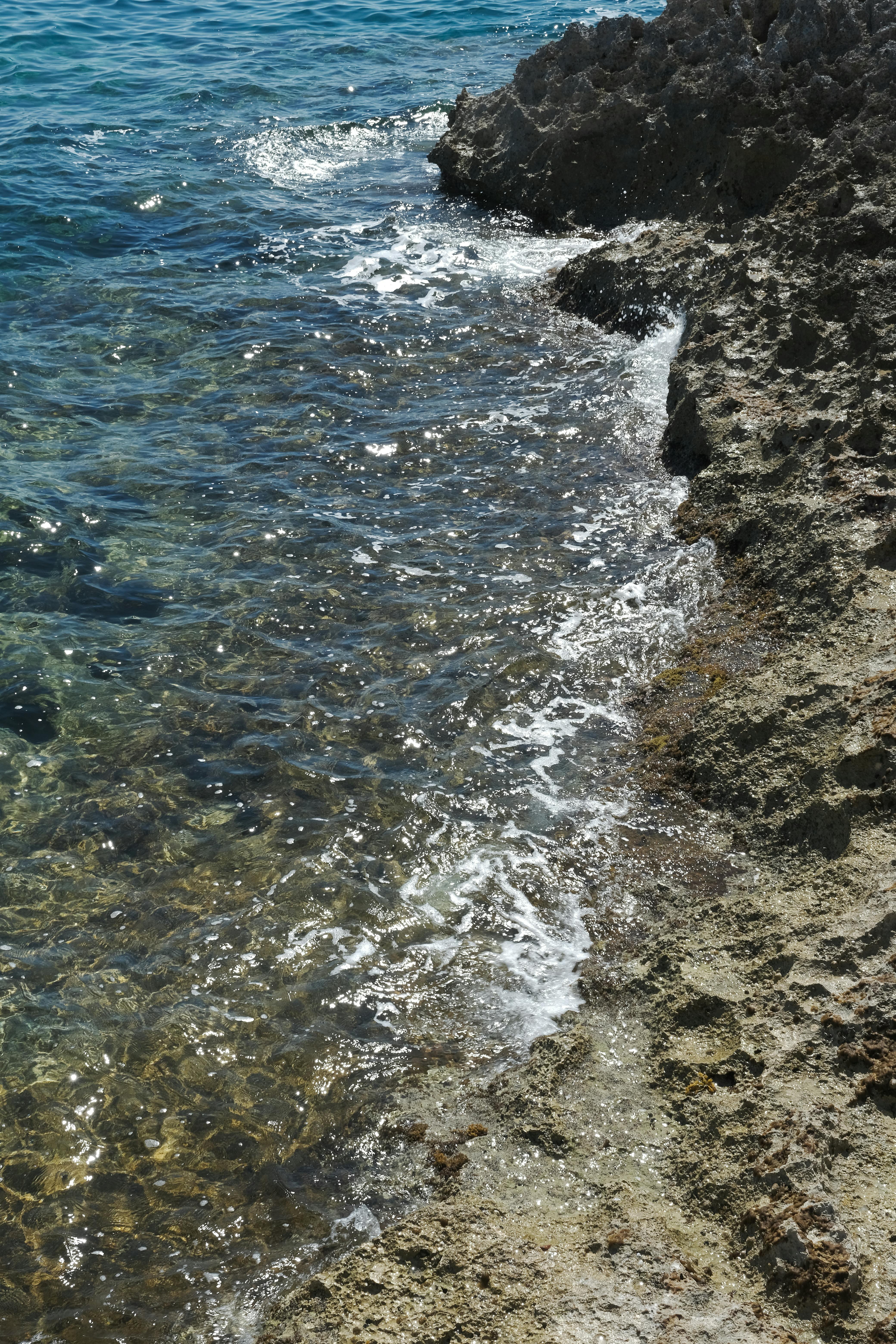Body of Water With Black Rock · Free Stock Photo