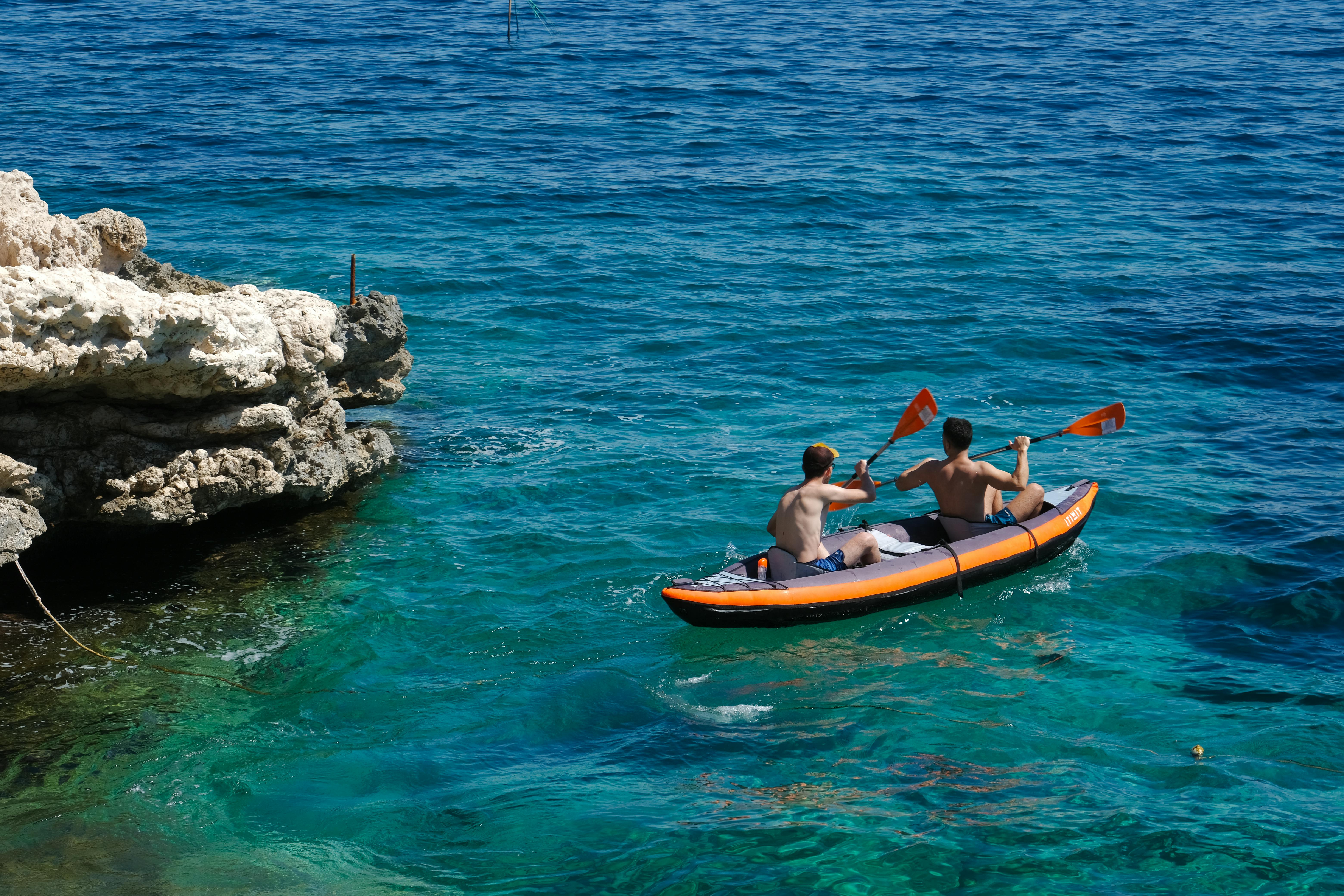 Two Men Kayaking in the Sea · Free Stock Photo