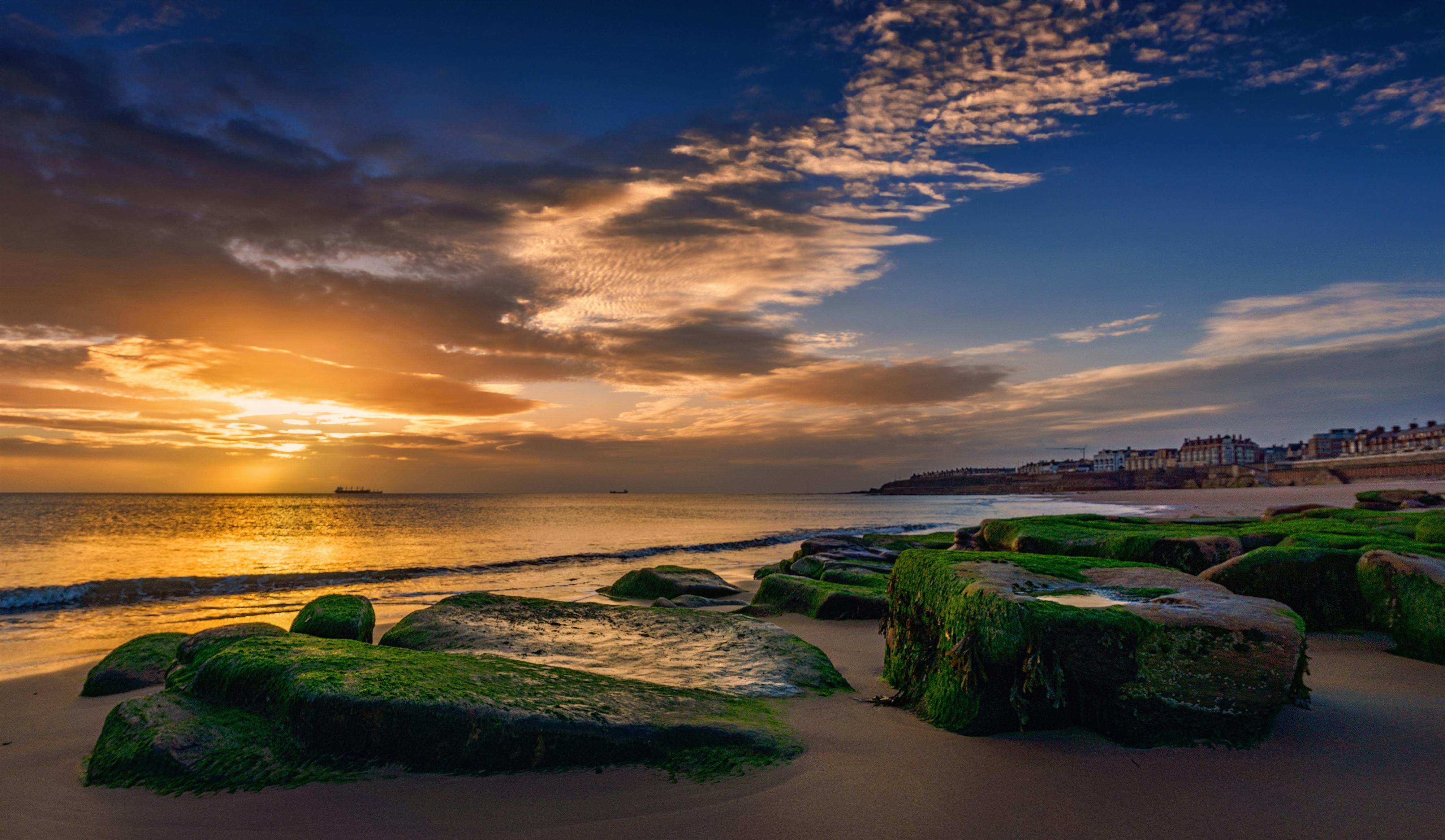 Rocks on Sea Shore at Sunset · Free Stock Photo